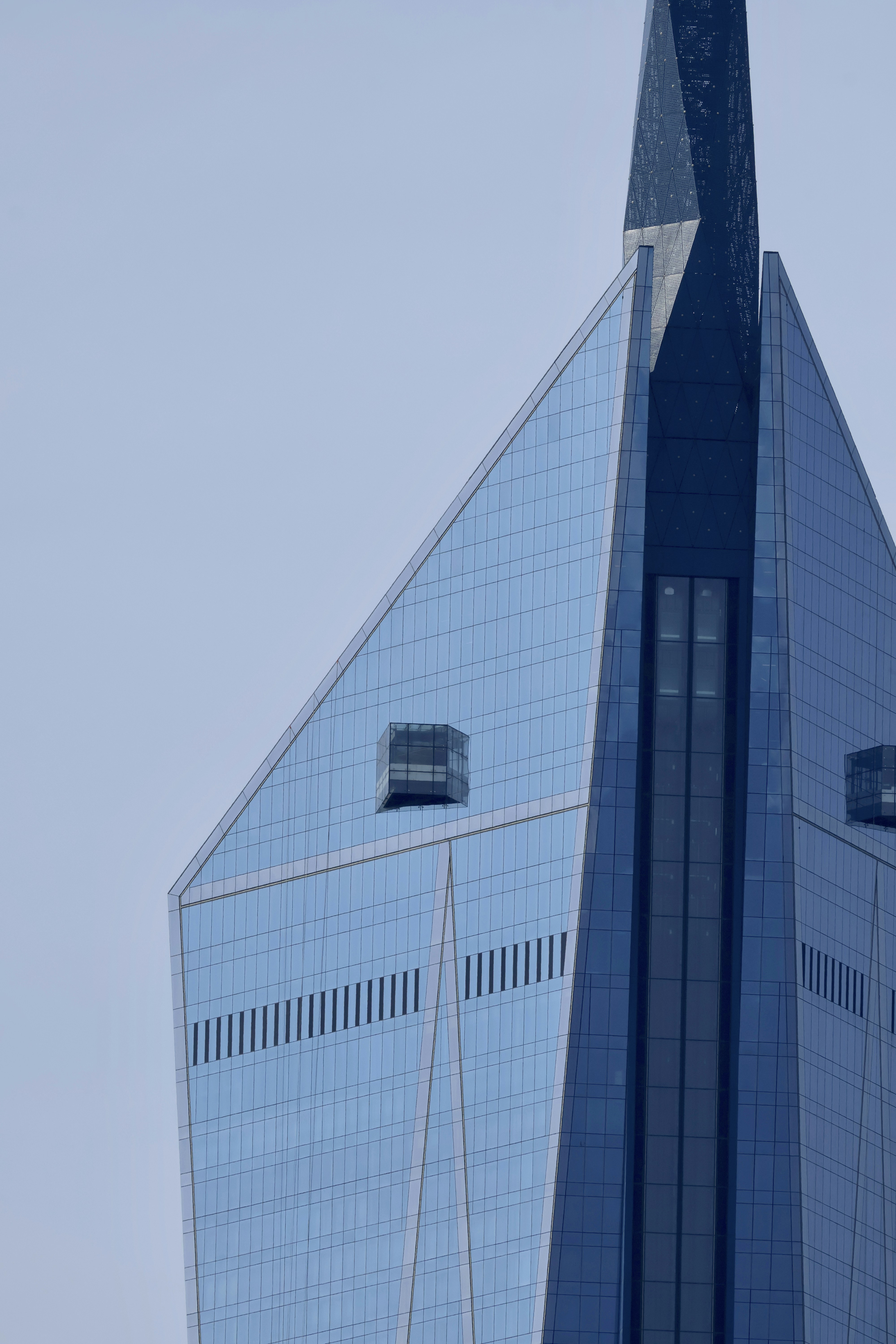 Blue Glass Apex: A Skyscraper Reaches Toward the Sky