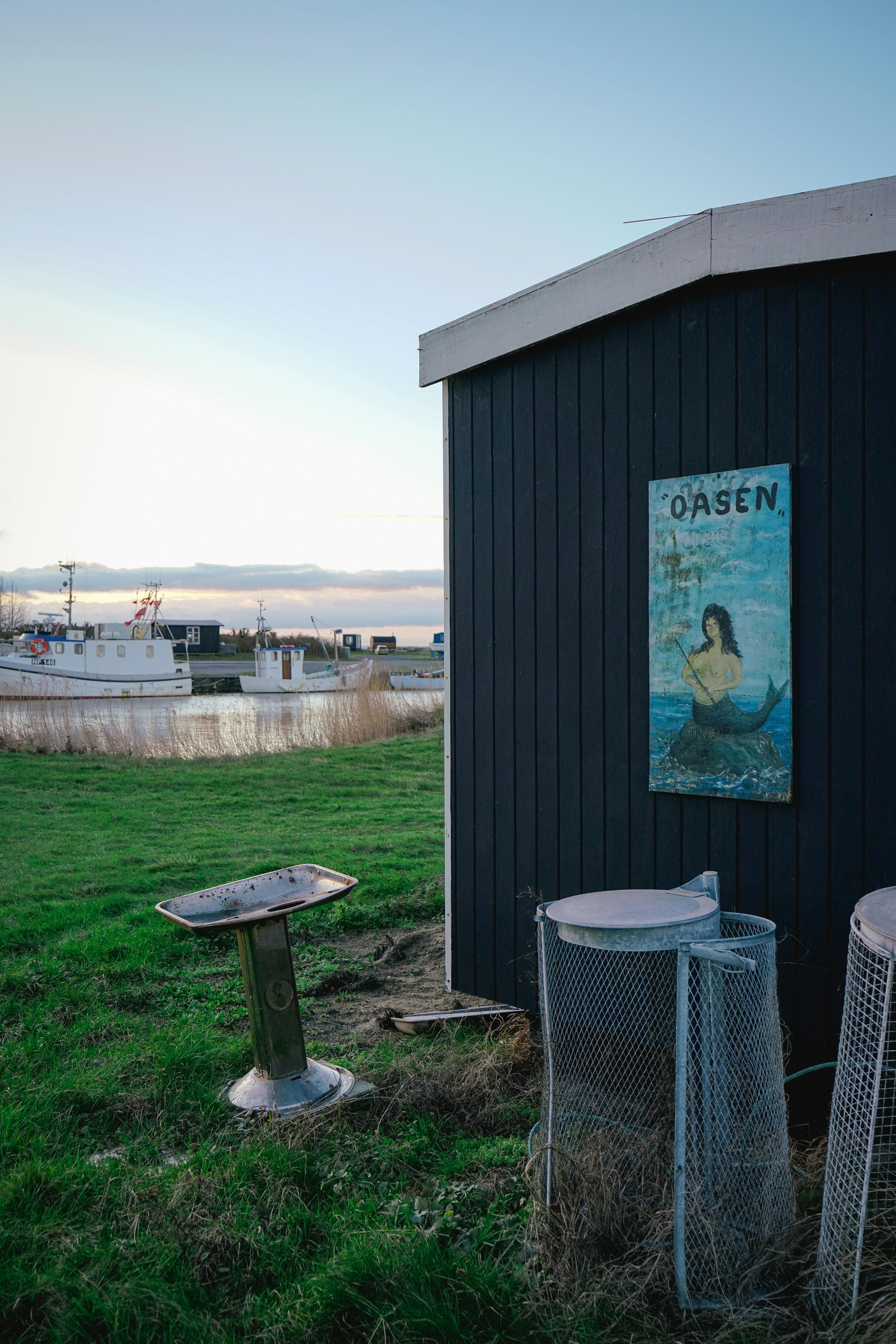 Harbor Glass and Painted Sign by the Shore