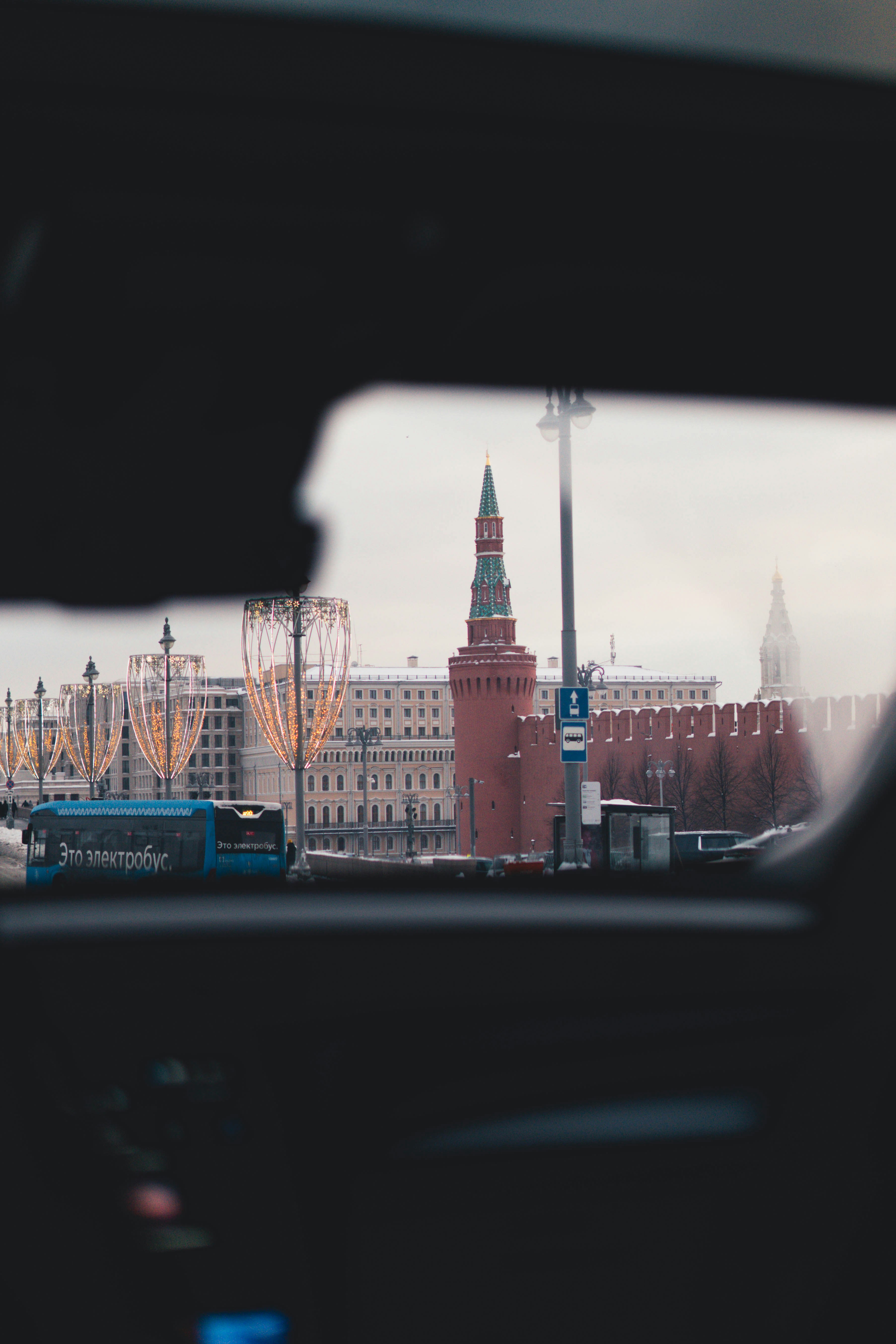 Through the Car Window: Moscow's Spires Framed by a Street Scene