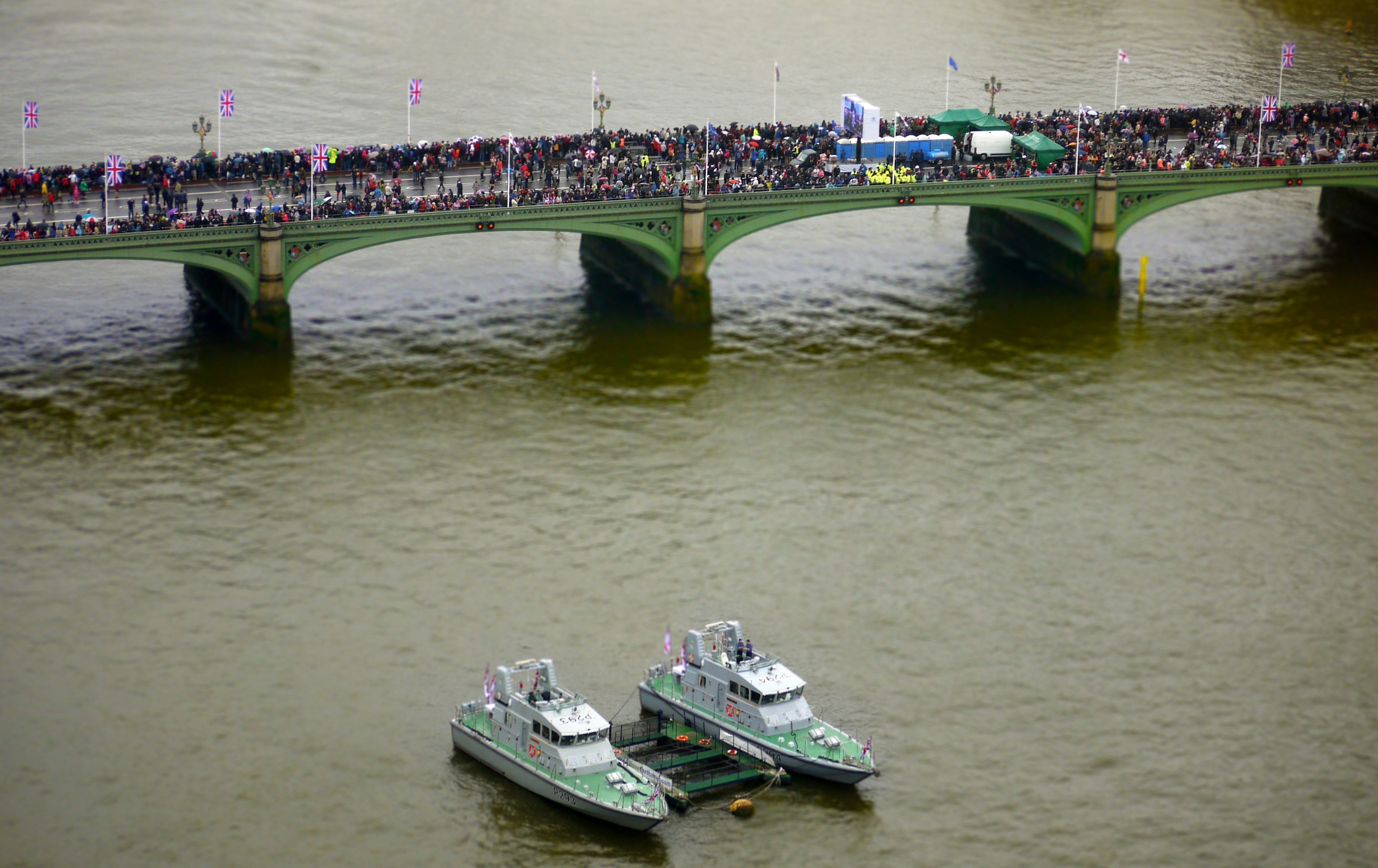 View from London Eye - Westminster Bridge, Thames River and rescue boats with tiltshift.