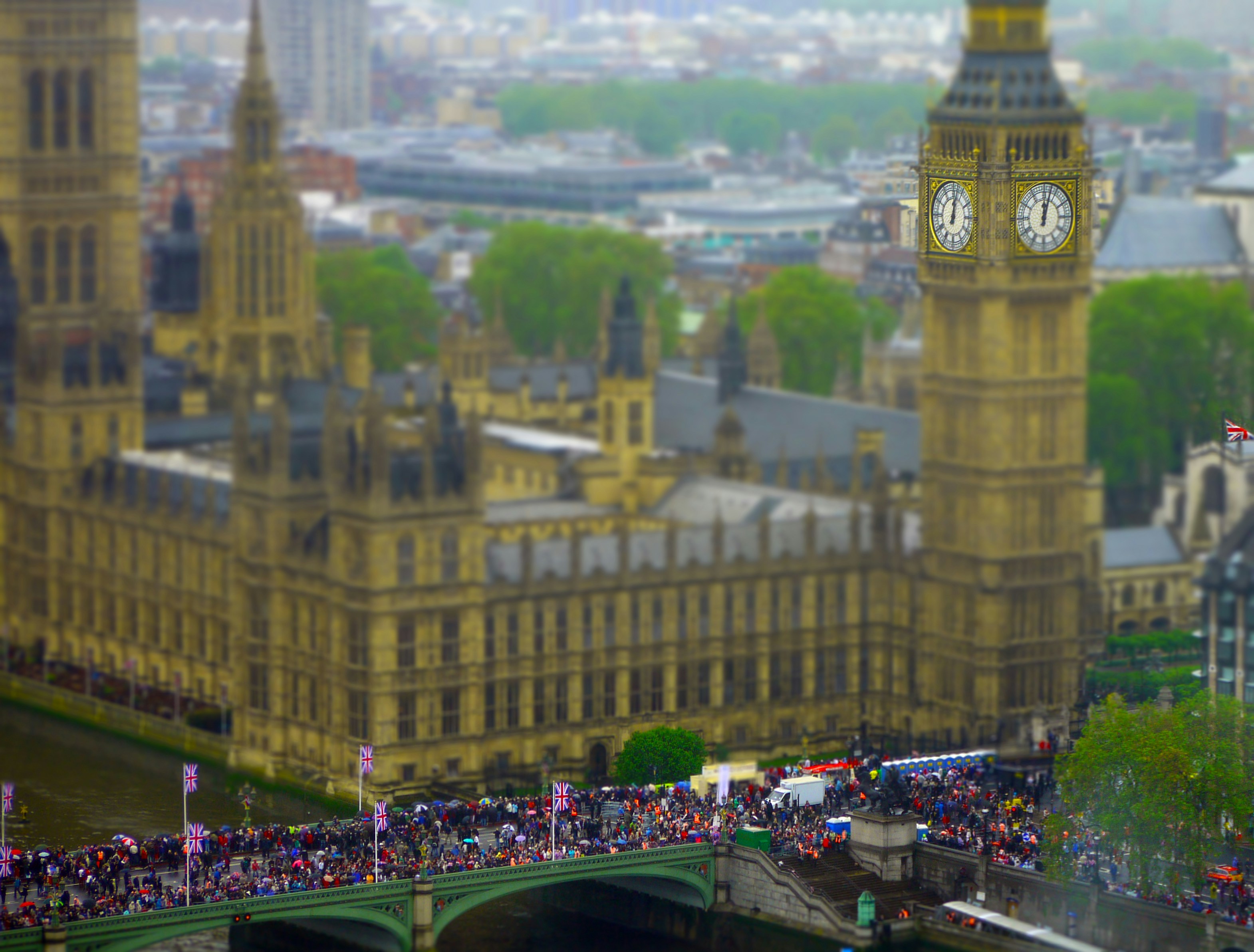 View from London Eye - Houses of Parliament, Big Ben and North West London on cloudy day with tiltshift. Queen Jubilee 2012