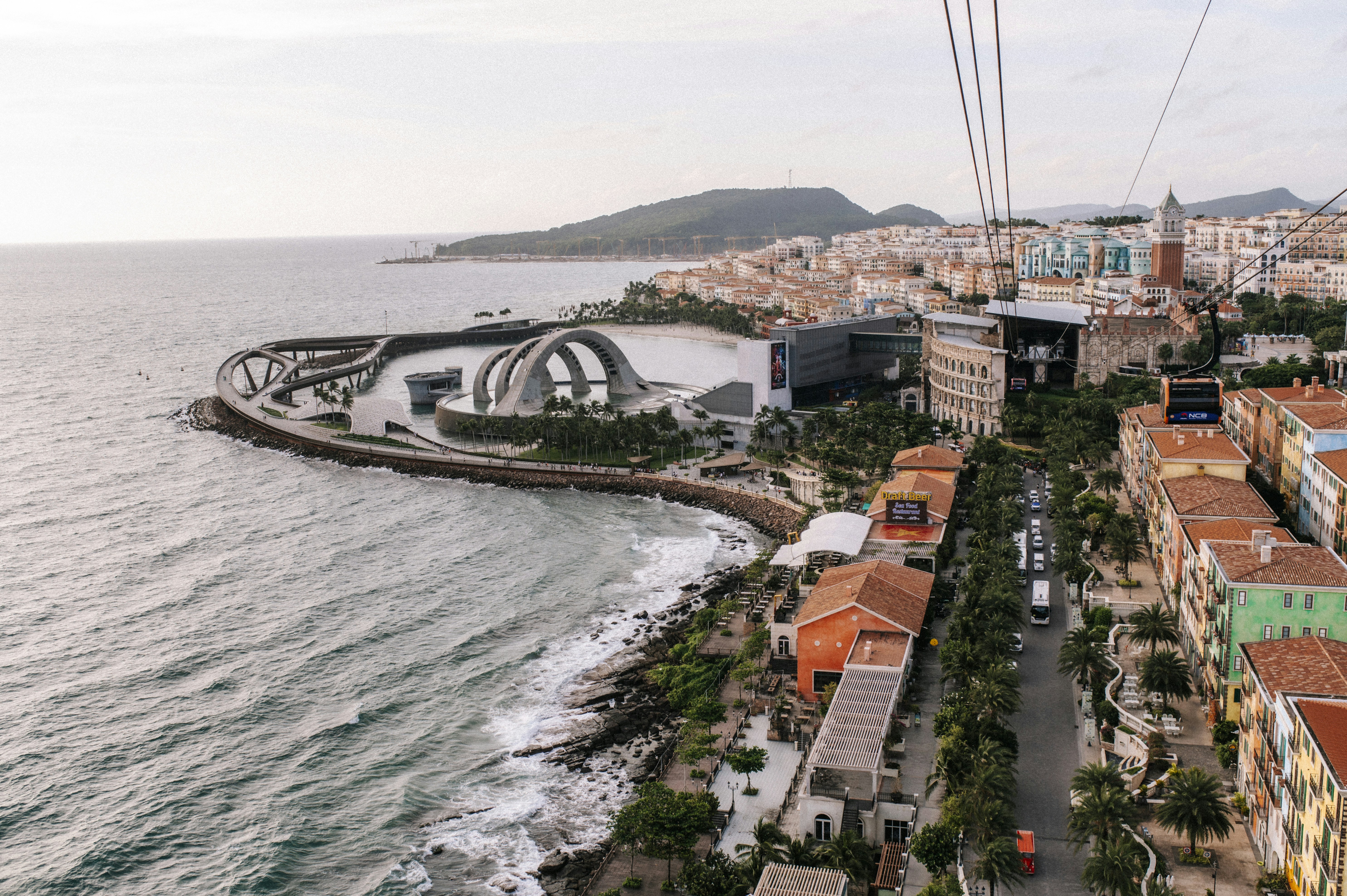 Ridge of Color: Coastal Cable Car Above a Painted Mediterranean Town