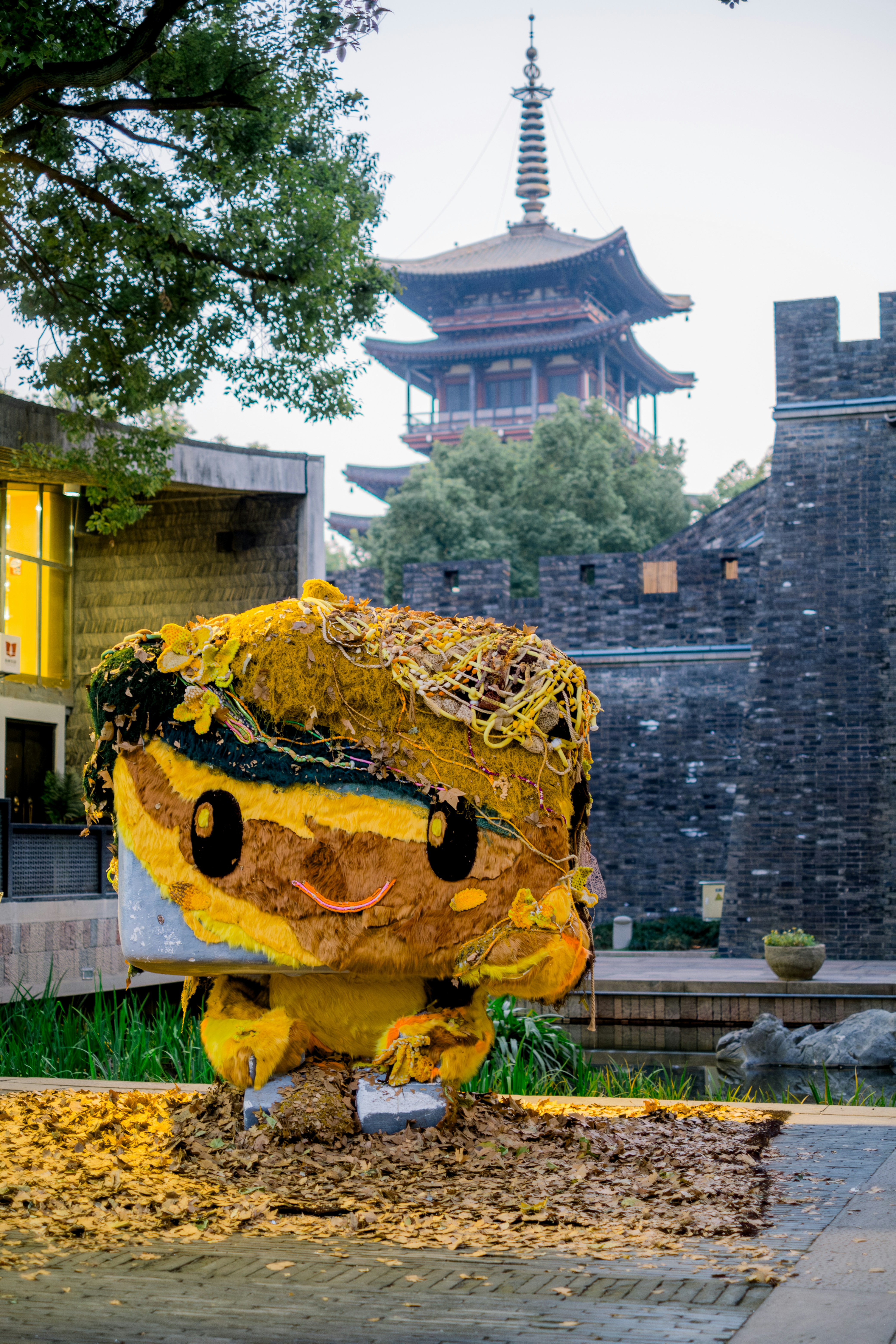 Laughing Moss Monster: A Garden Idol with a Pagoda Backdrop