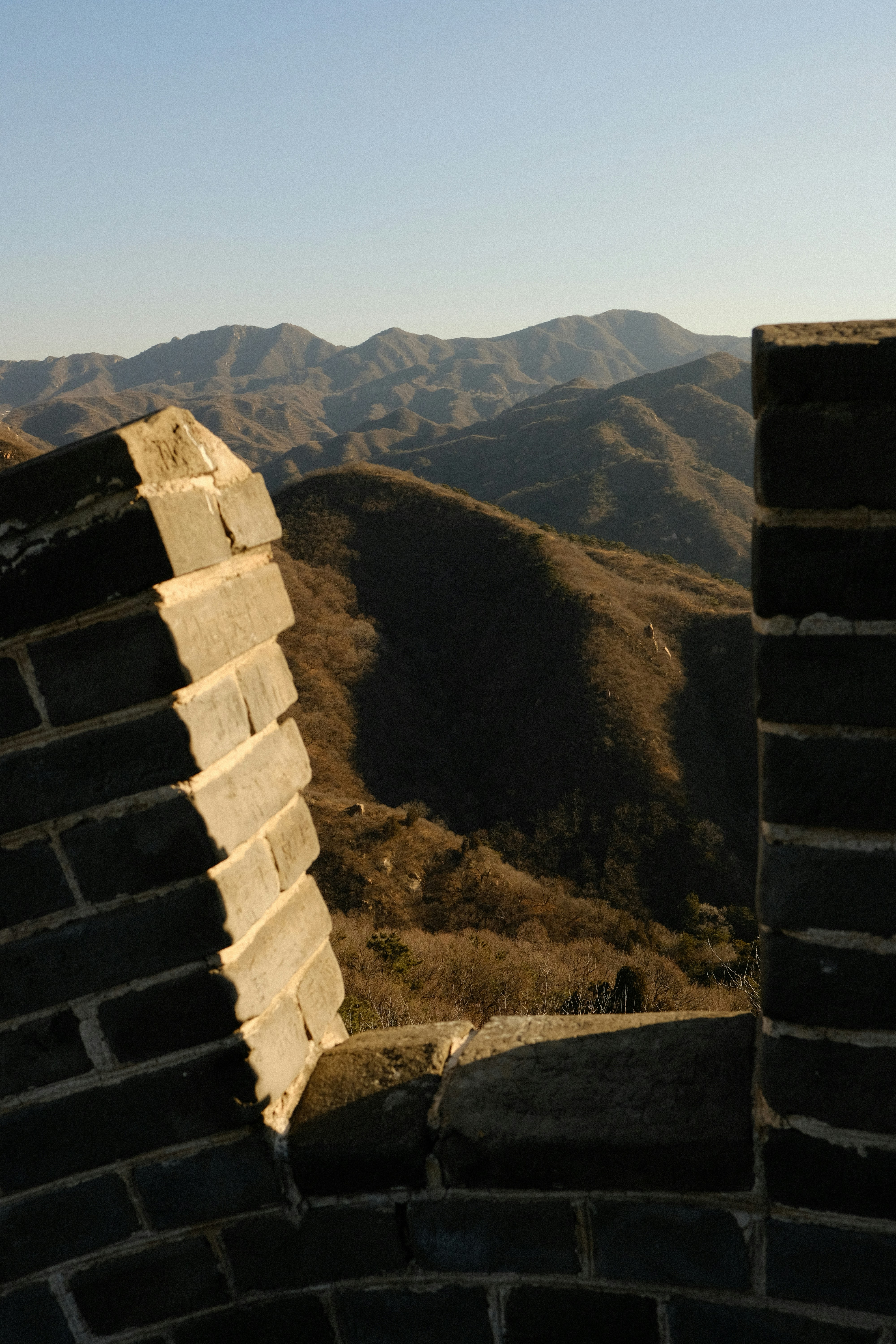 Stone Fragments Framing a Distant Mountain Range