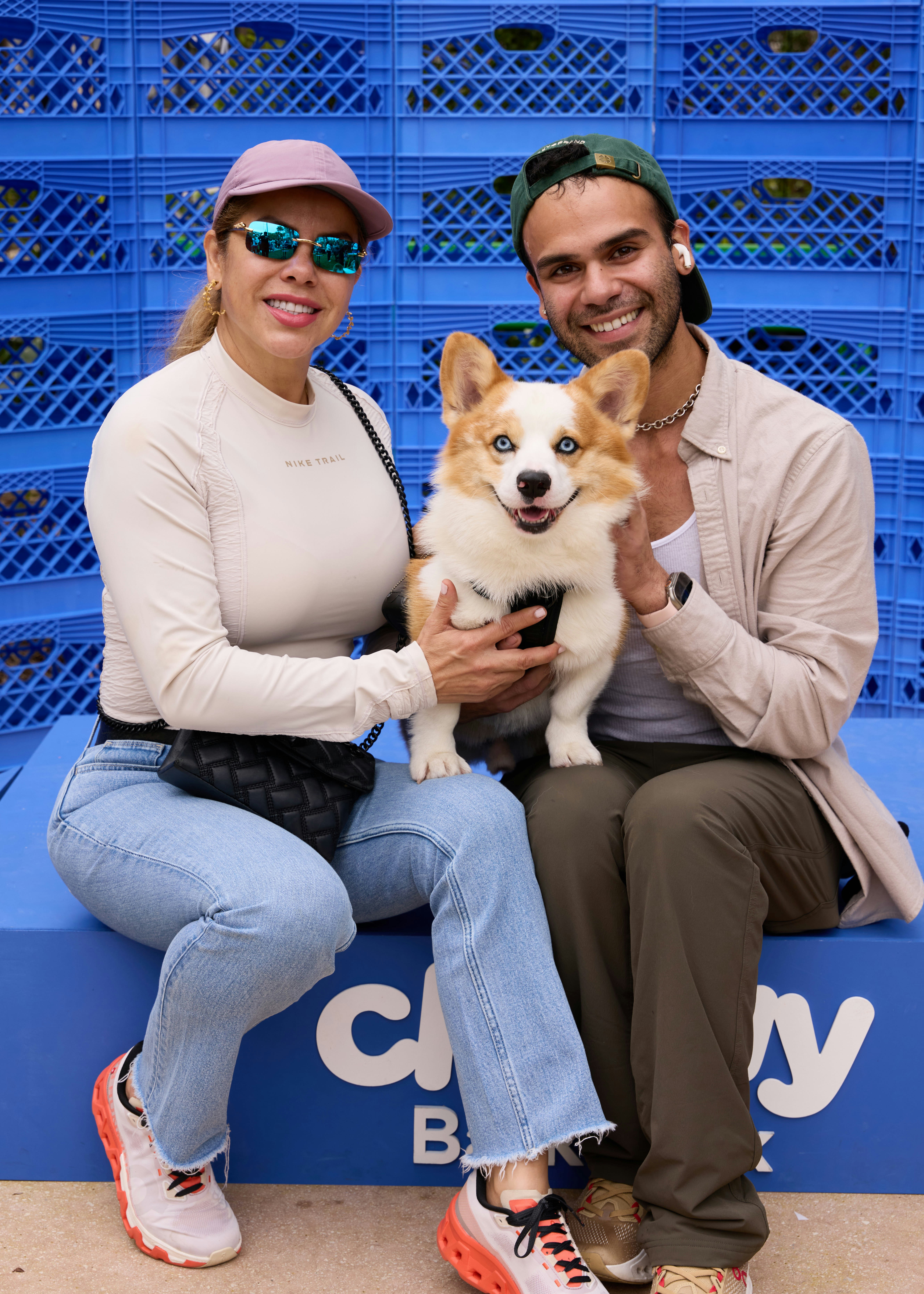 Smiles and Pup: A Sunny Moment with a Corgi in Blue Crate Backdrop