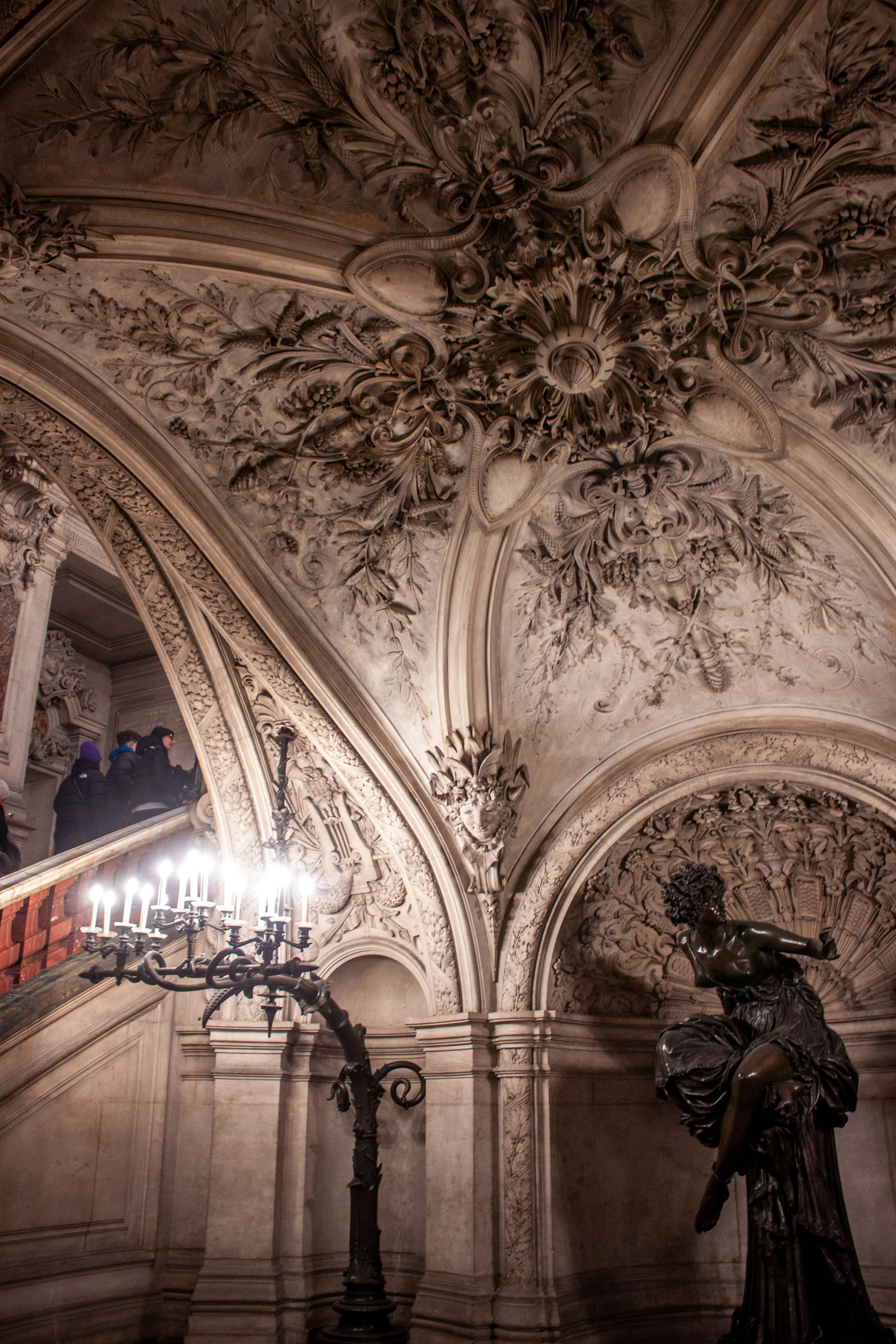 Gilded Vaults and a Standing Figure: An Urban Cathedral in Candlelight