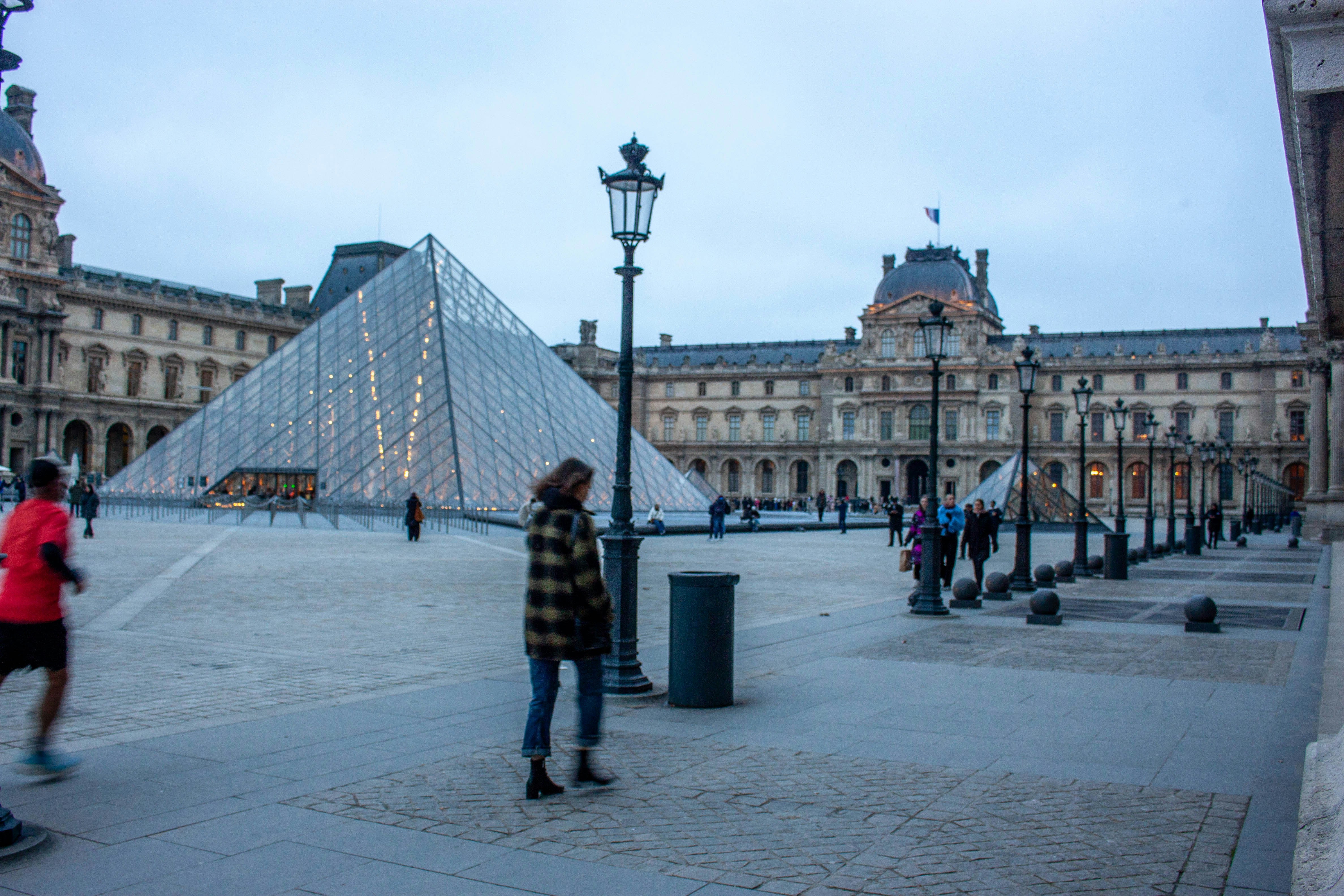 Glass Pyramid at the Louvre: People, Lamp Posts, and Historic Facade