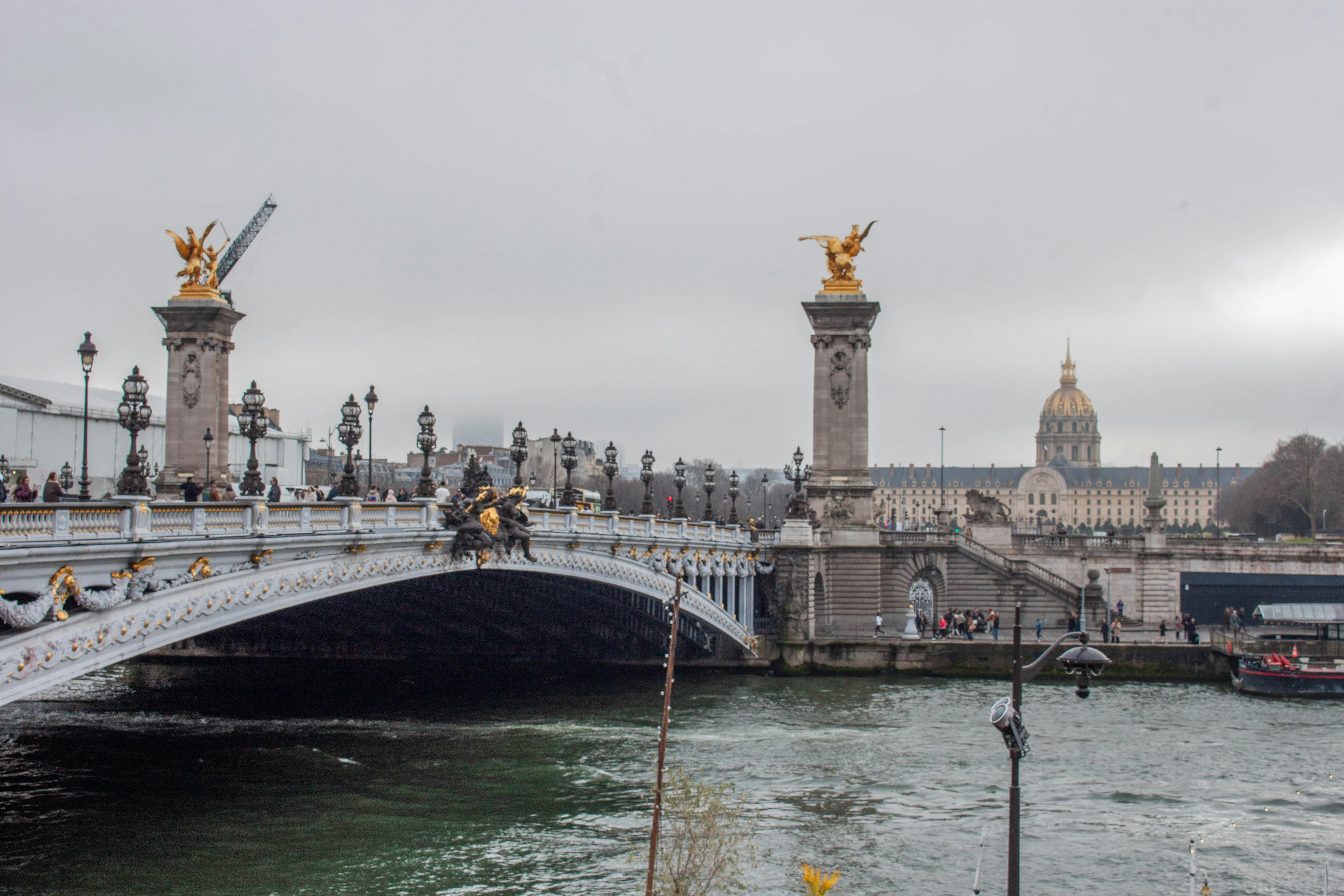 Golden Figures Guarding the Seine: A Misty Parisian Bascule