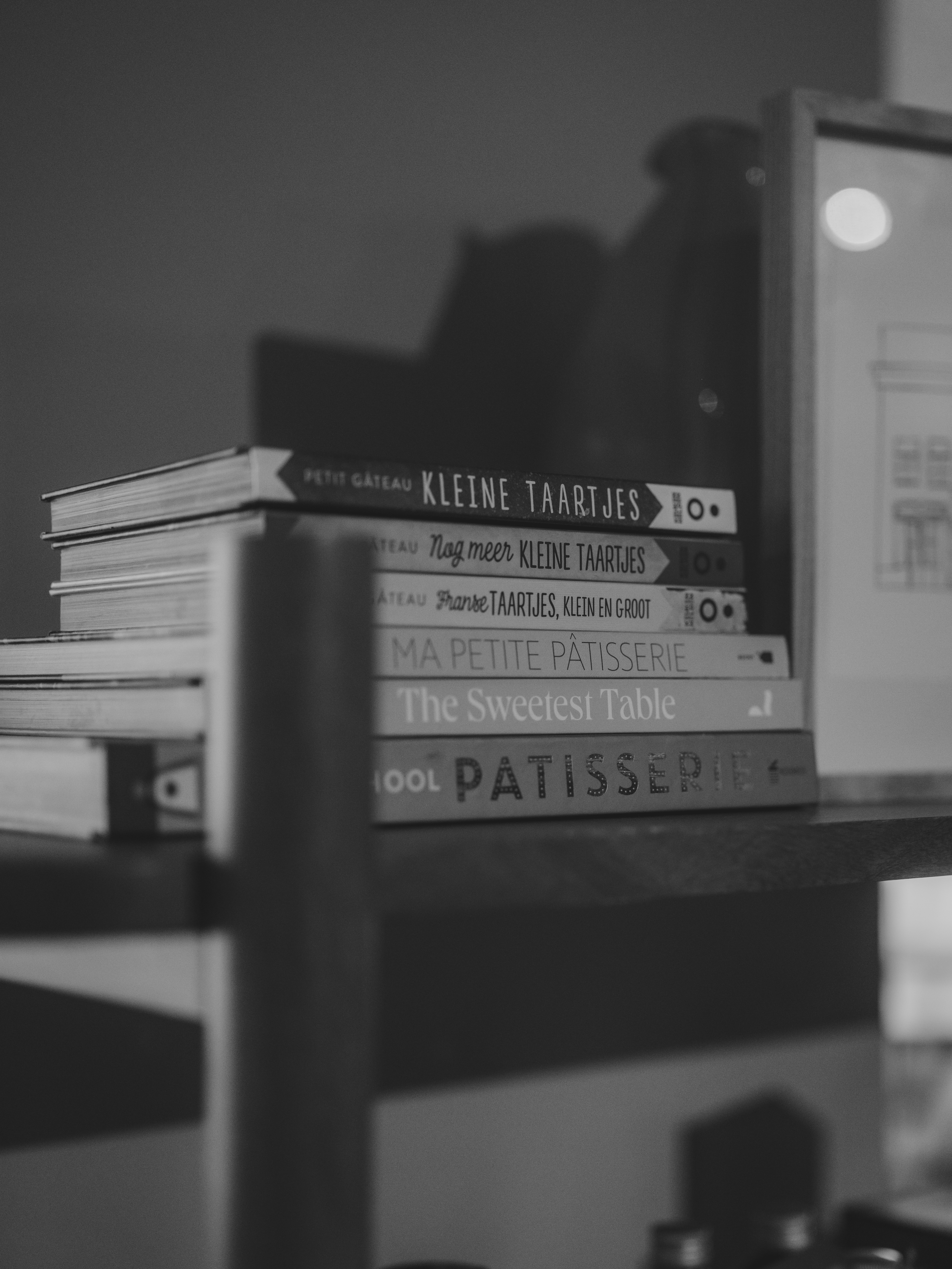Stack of quiet recipes: a bookshelf in grayscale