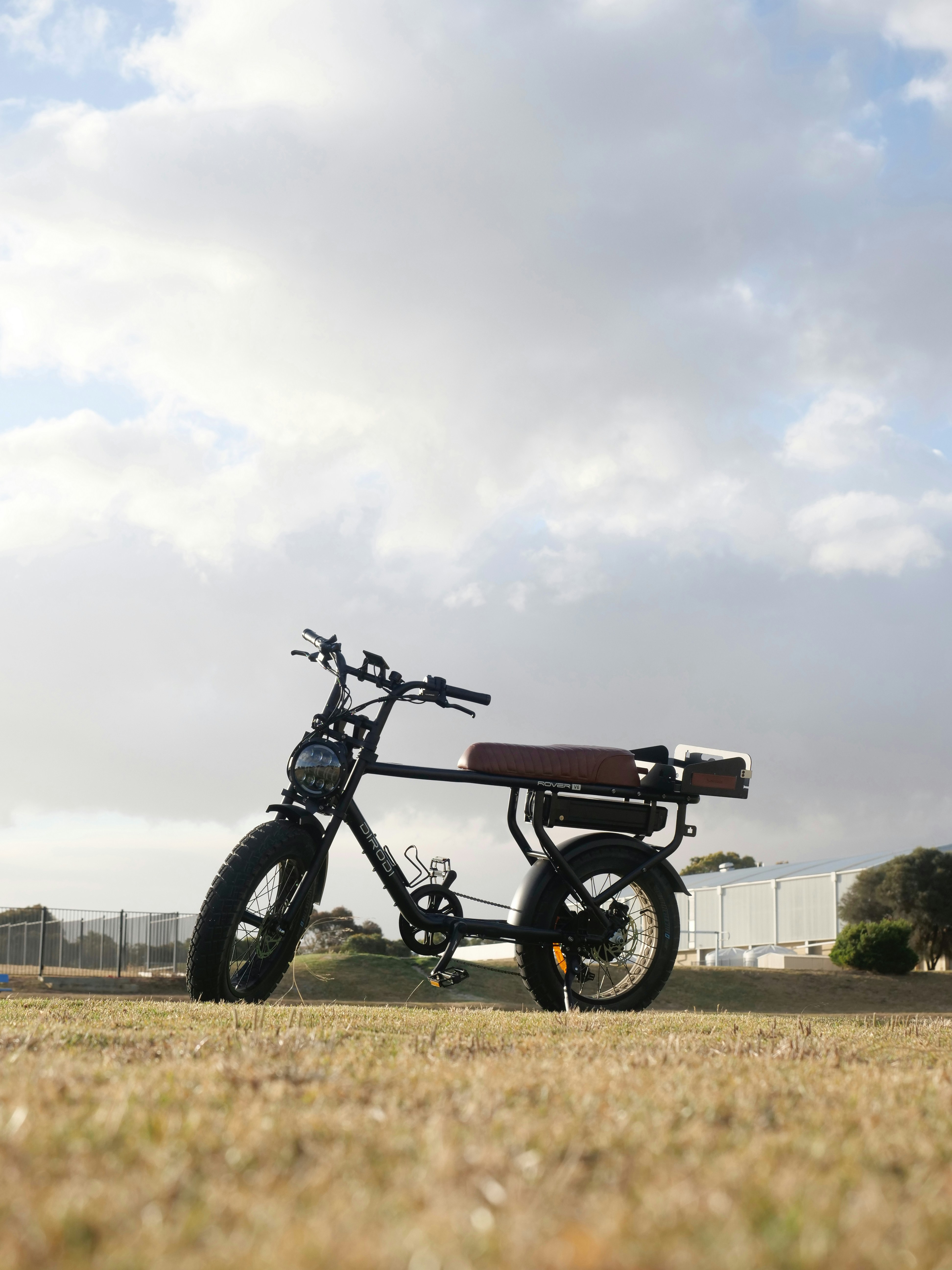 Electric Steed: A compact electric bike rests under a vast sky