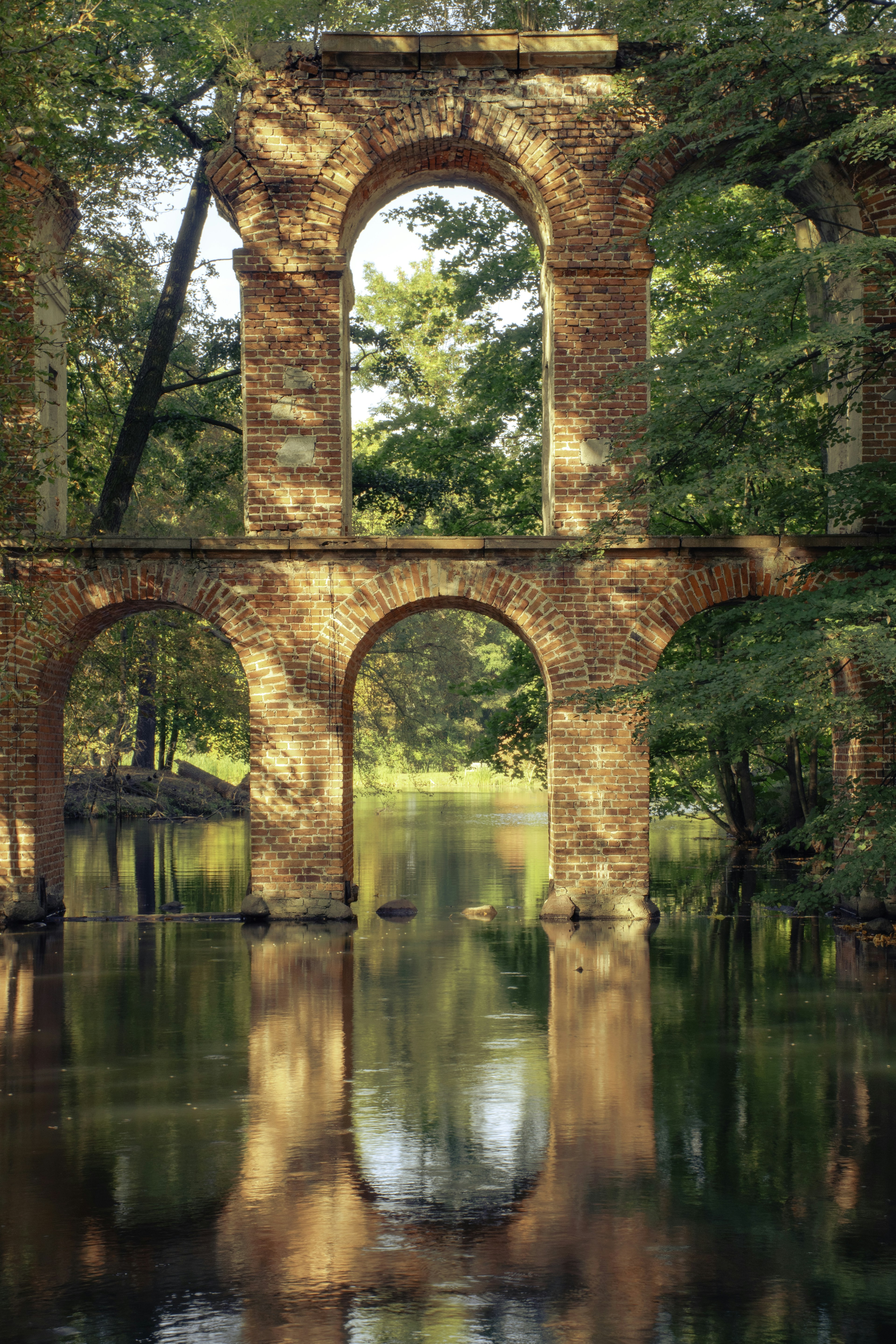 Ruined Brick Arch Over Quiet Waters