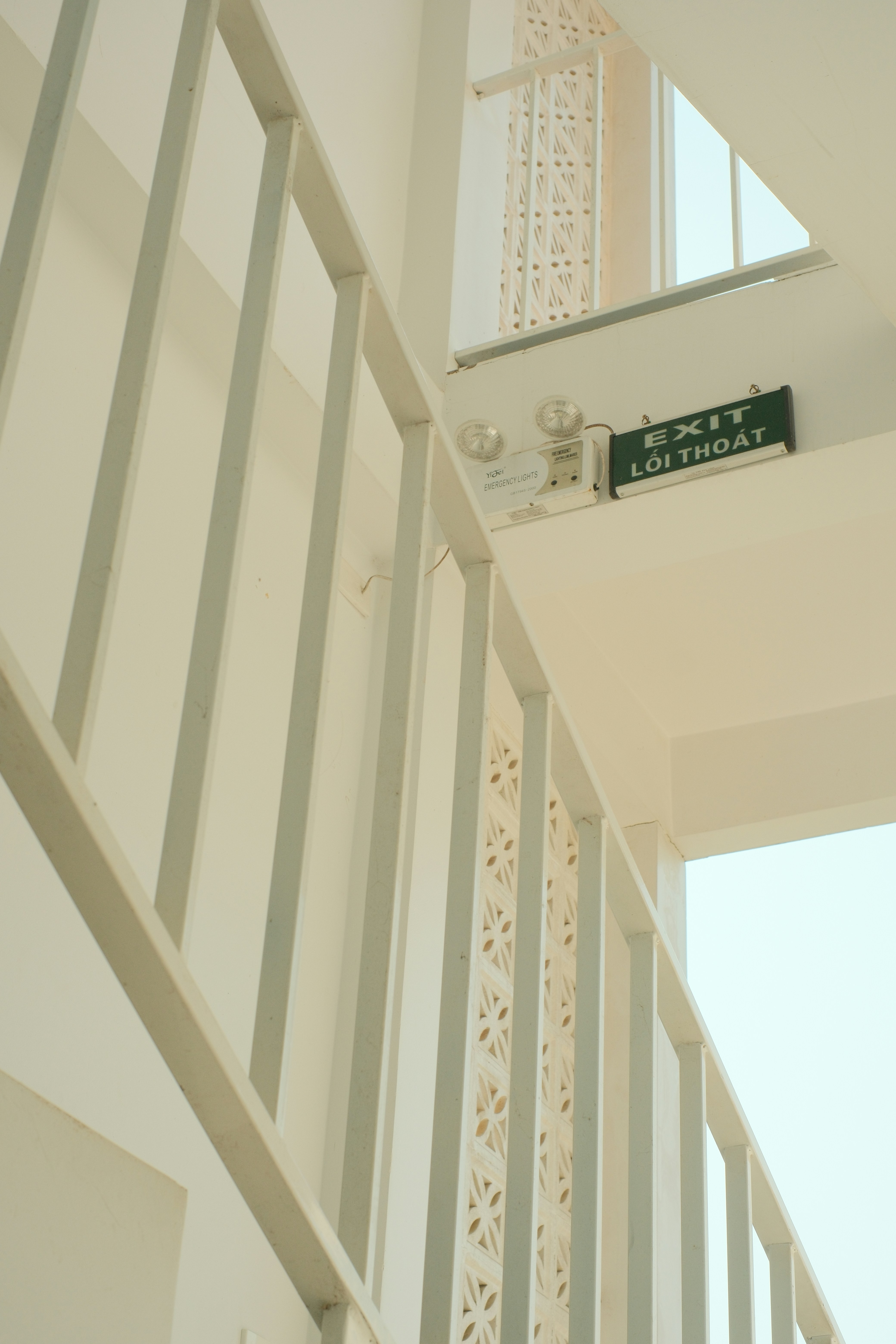 Vertical Escape: Architectural Stairwell and Exit Sign