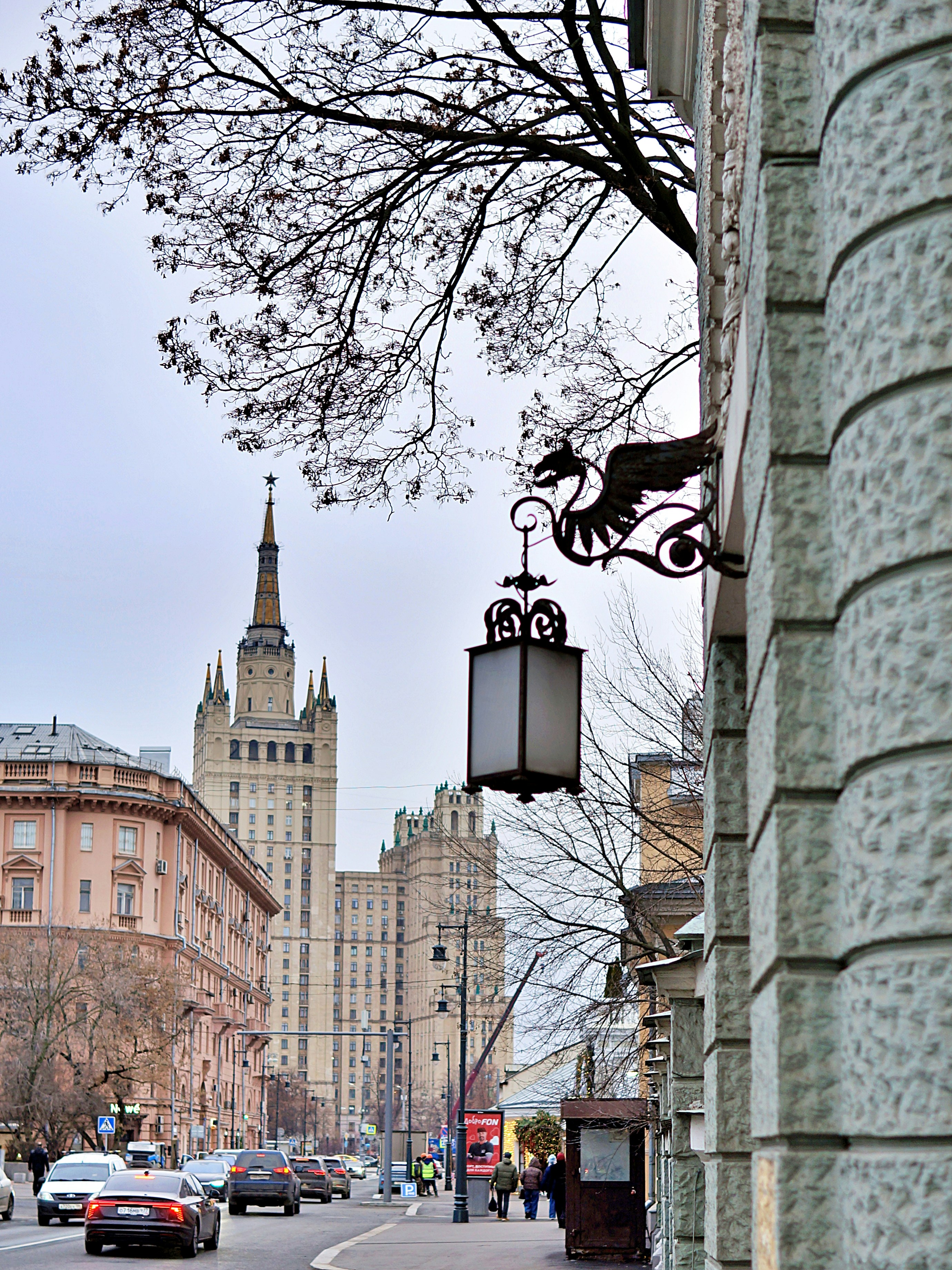 City Lanterns and Gothic Spire: A Street Between Architecture