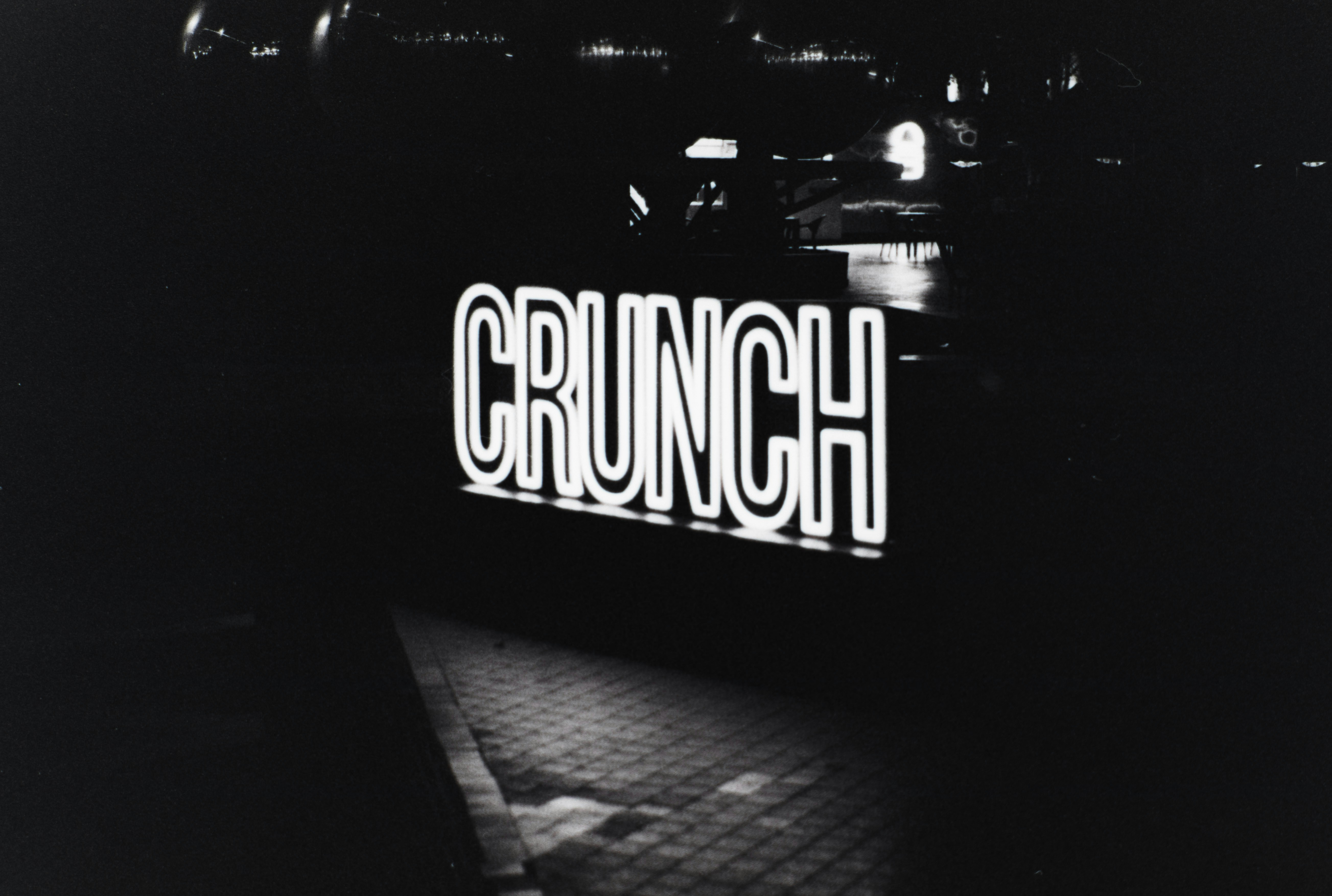 Neon Crunch Sign in Quiet Night Street