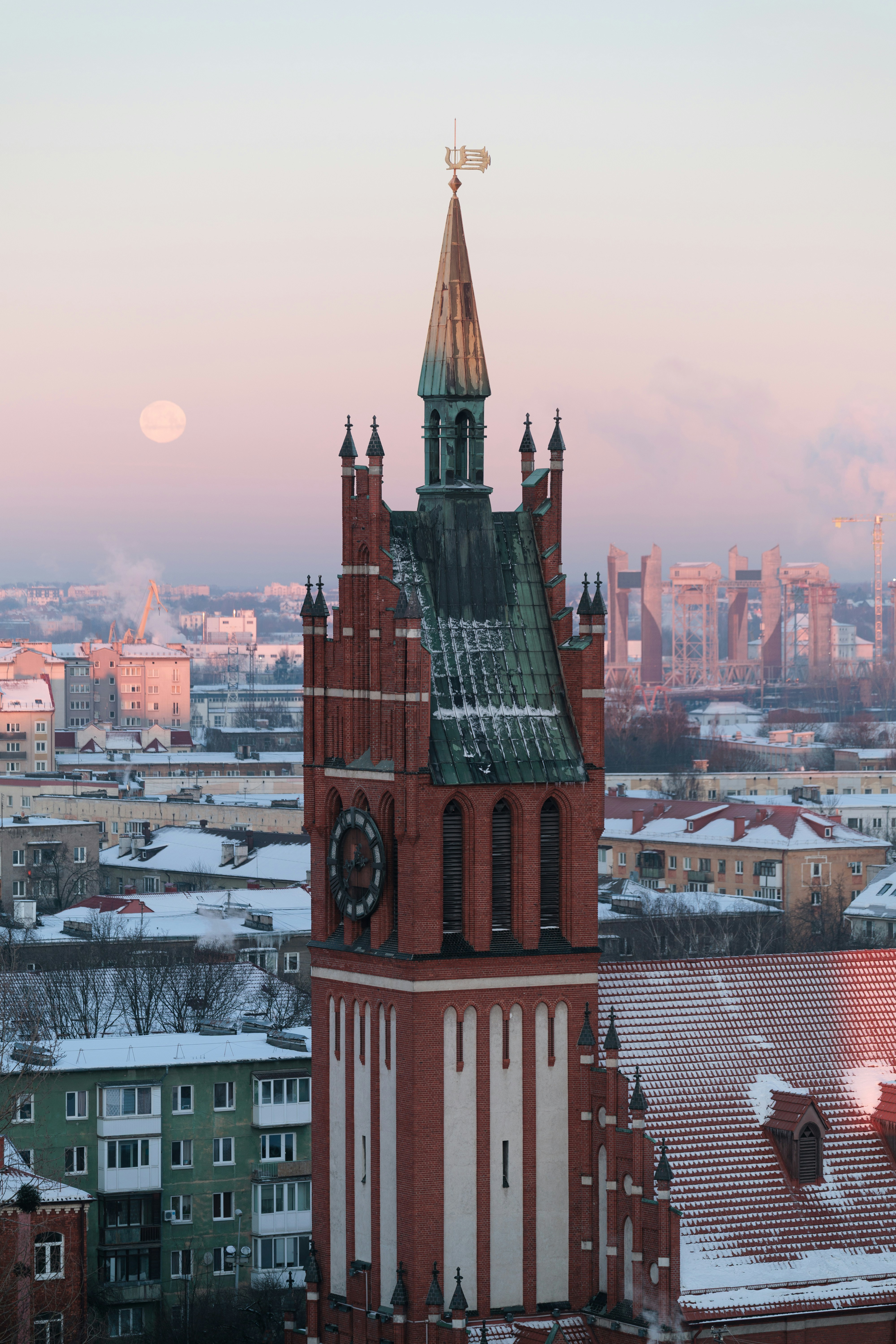 Winter Clocktower: Dawn Light Over a Snow-Blanketed City