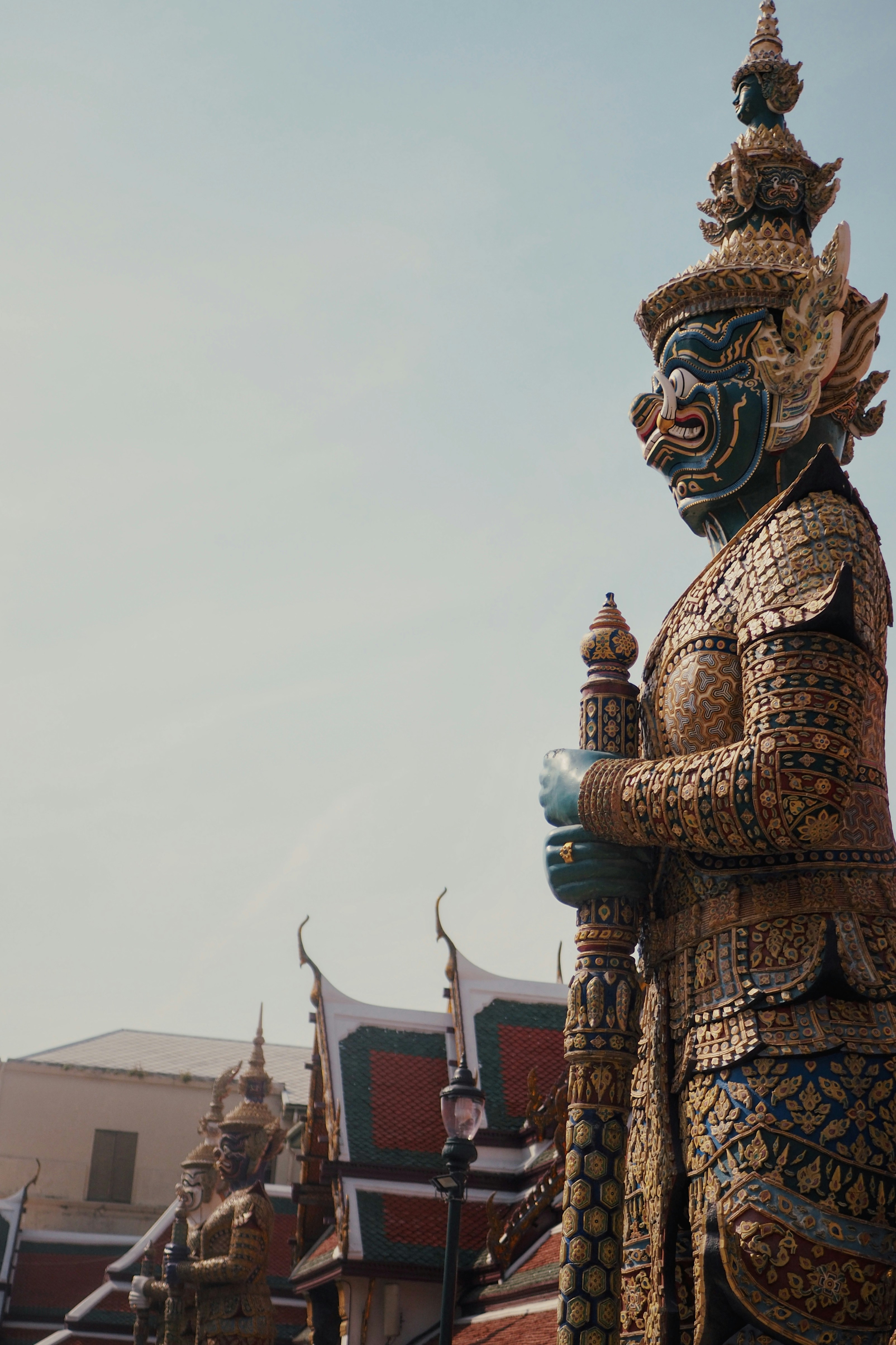 Guardian in Golden Attire at Temple Complex