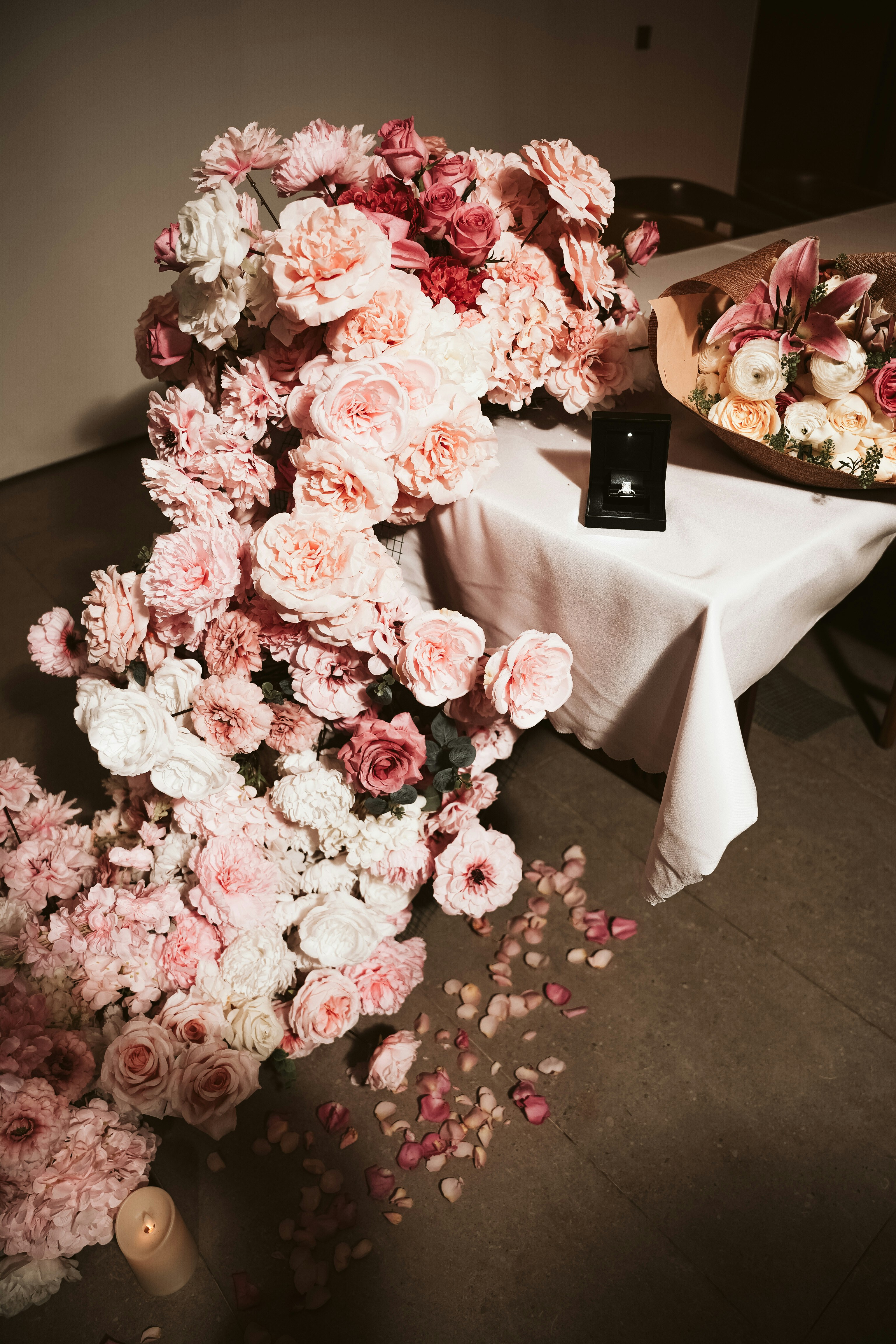Cascade of Blush Roses: A Floral Arrangement Draped Across a Table