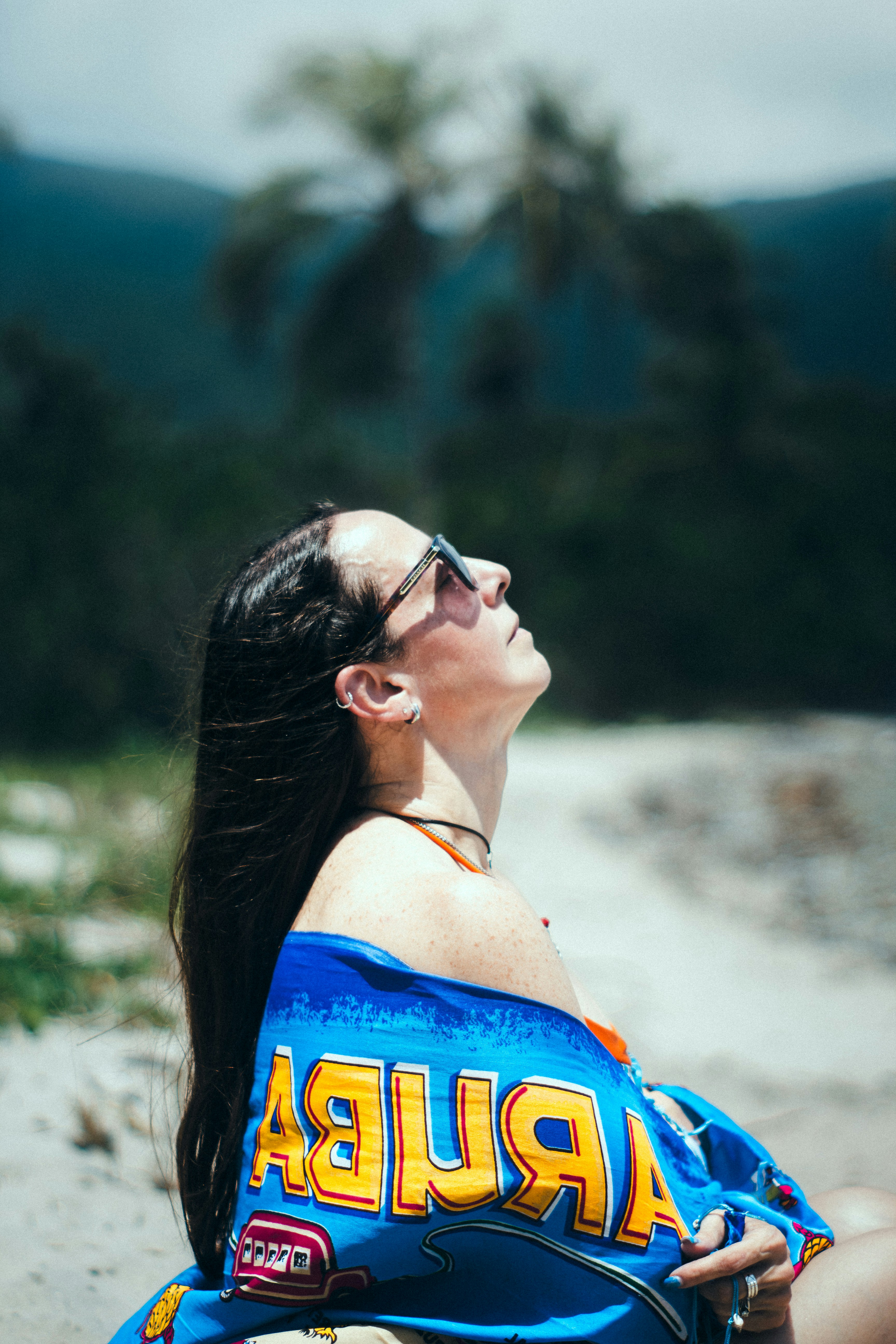 Sunlit Reverie: A Portrait with a Bold Beach Shawl