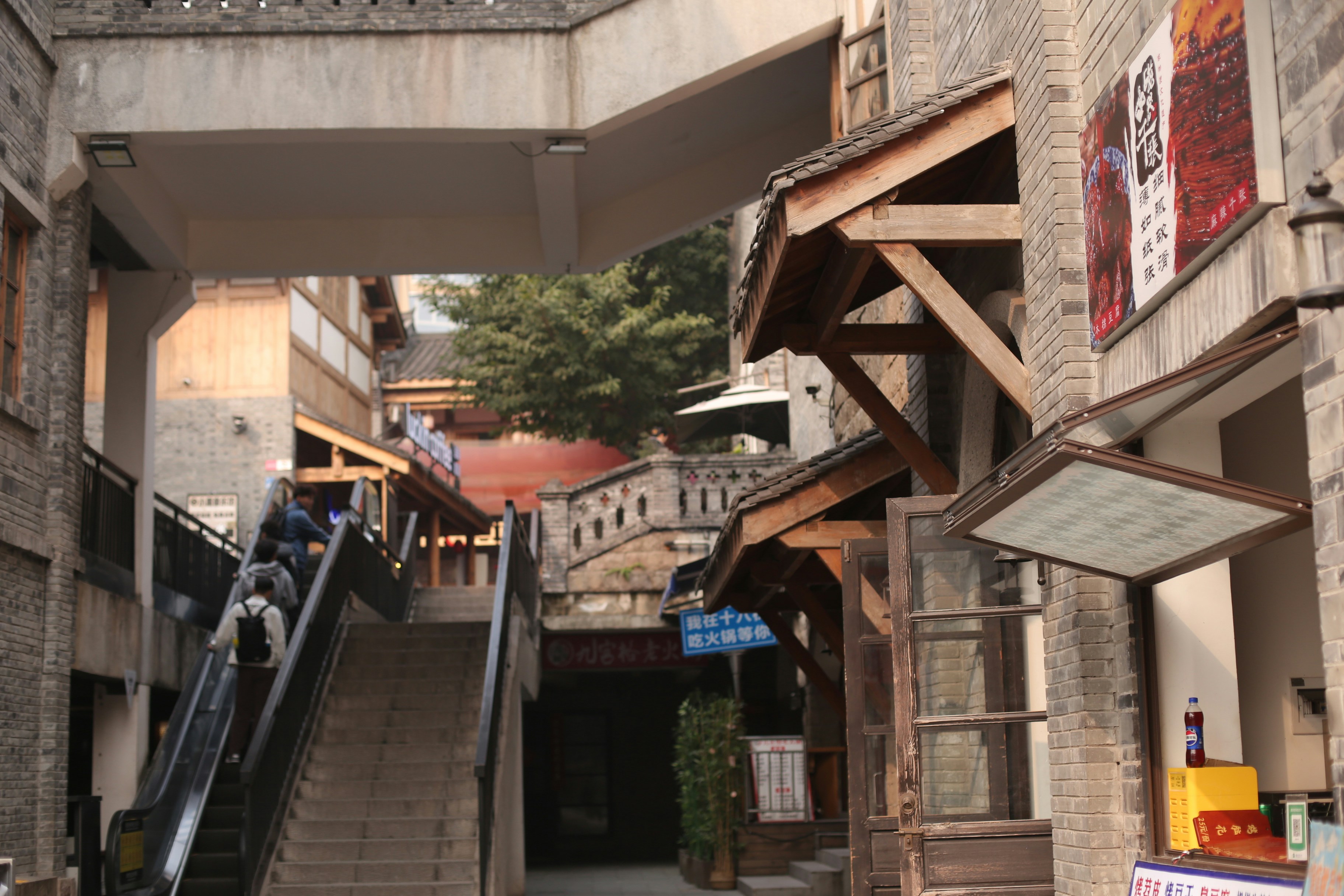 Hidden courtyards and stairs: an urban passage through stone and timber