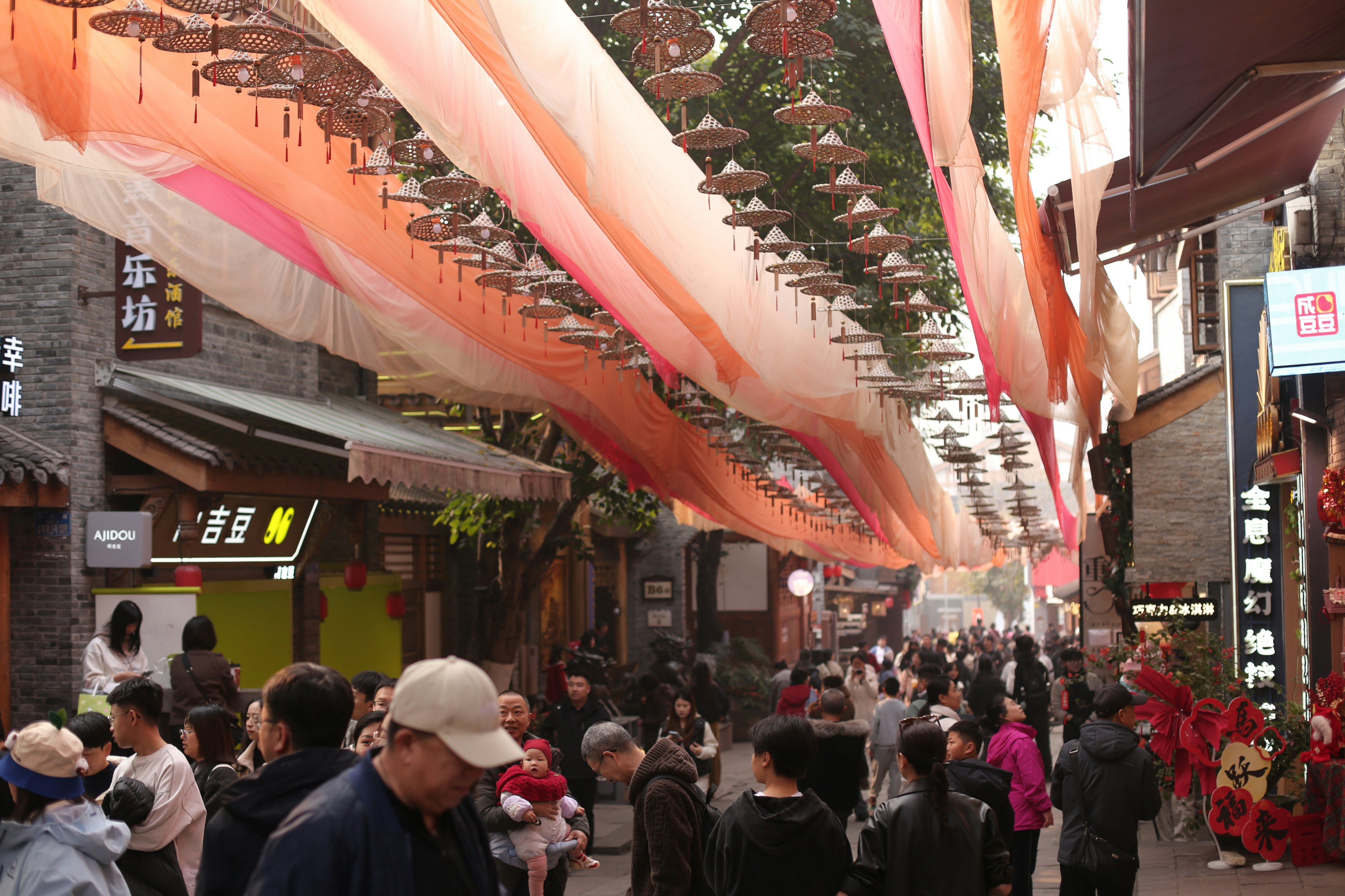 Canopy of Banners Over a Bustling Street Market