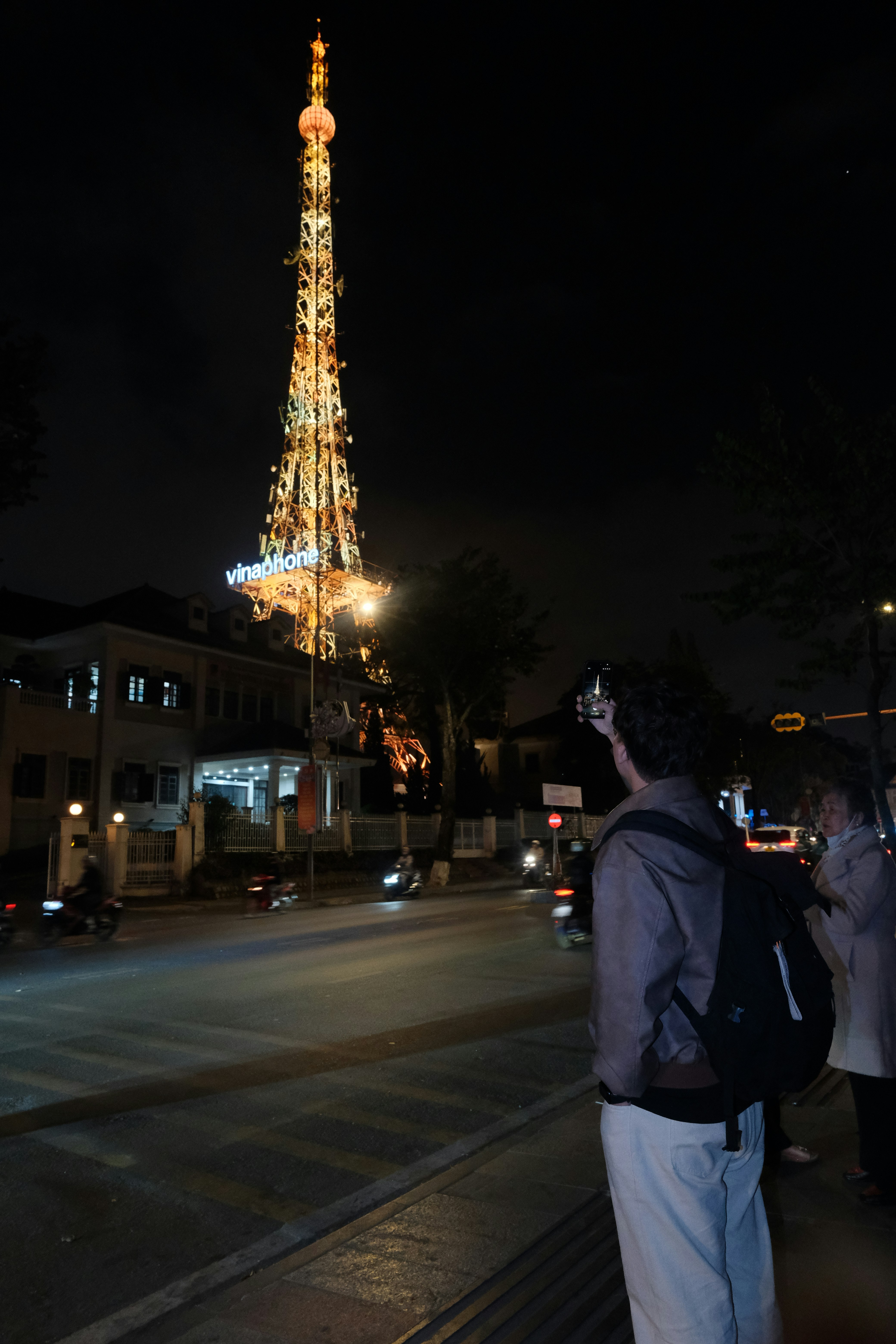 Night Beacon: Towering Lights Over a Quiet Street