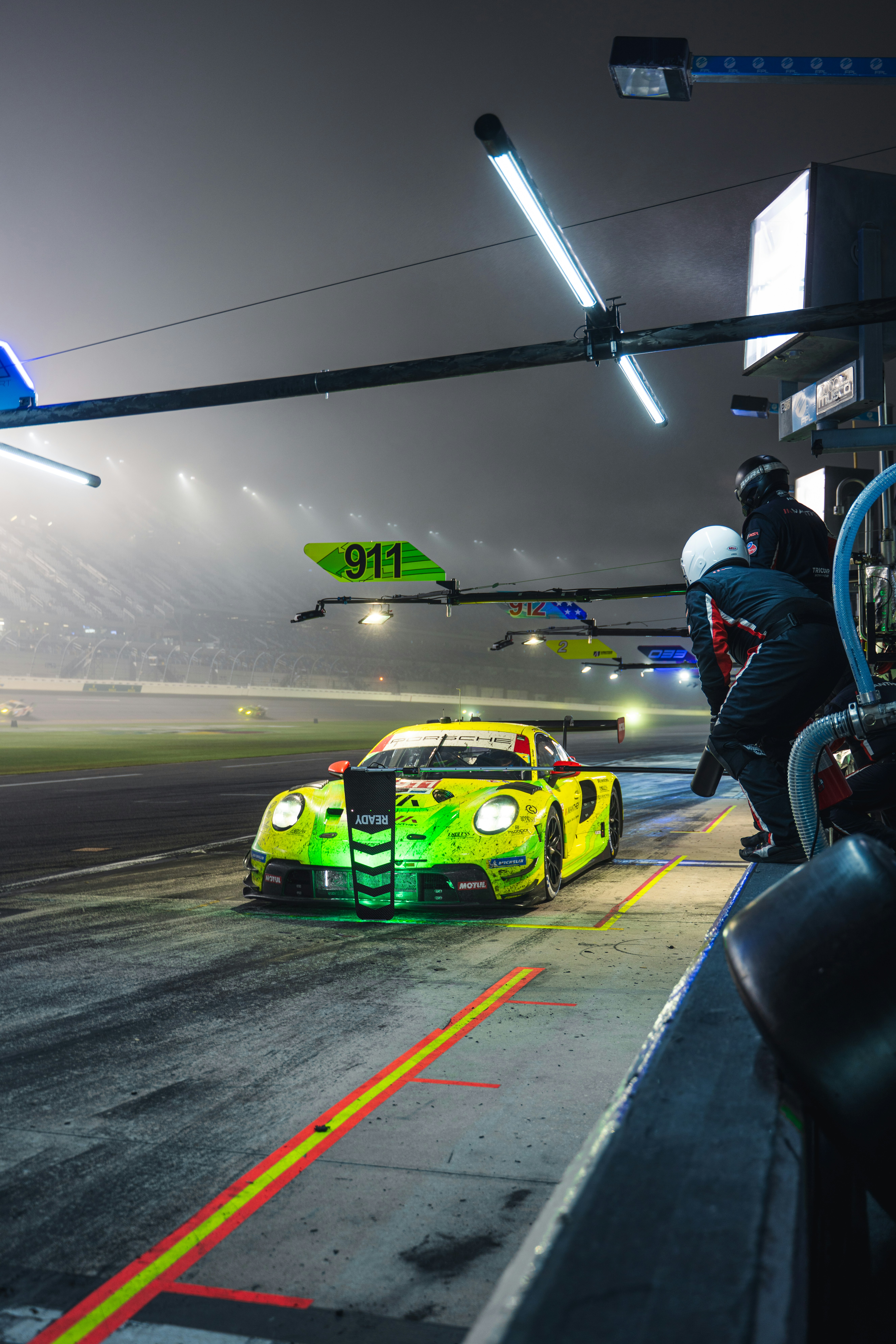 Manthey number 911 “Grello” coming in for a driver change, fuel and tyre stop at the Rolex 24 Daytona, during the record breaking full course yellow.