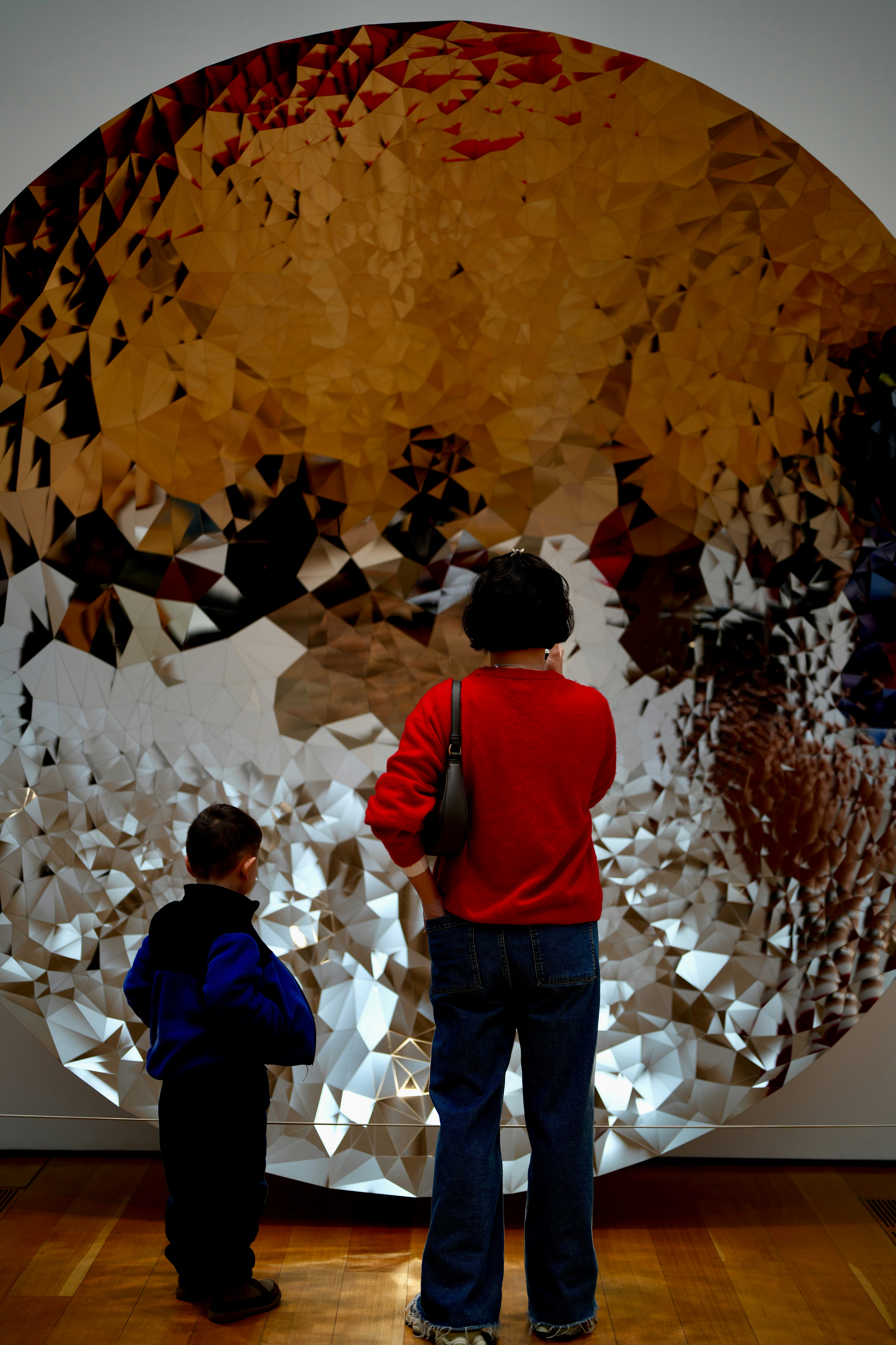 Reflective Echo: A Red-Sweater Moment in a Faceted Dome