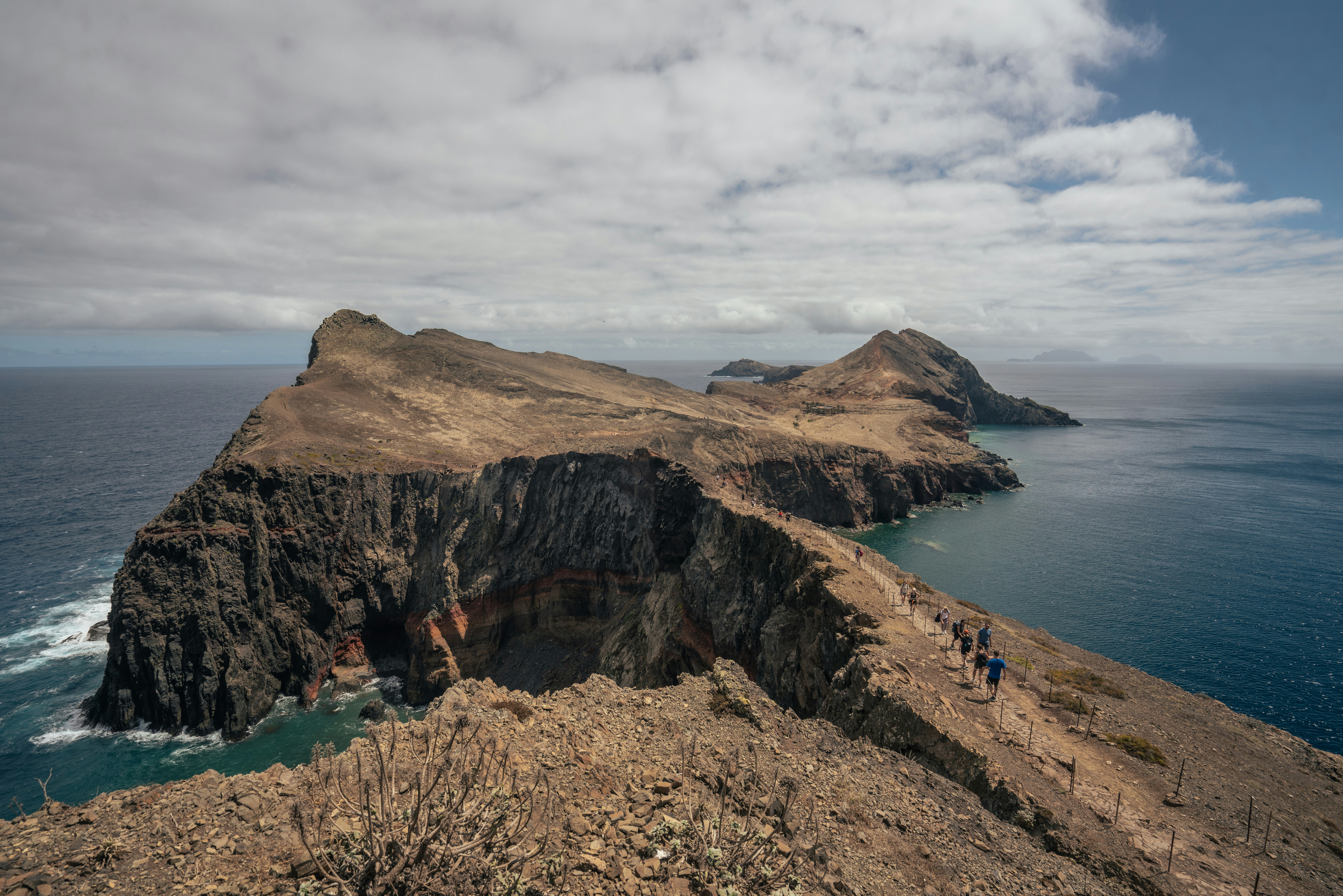 Cliffside Trail to a Distant Arch