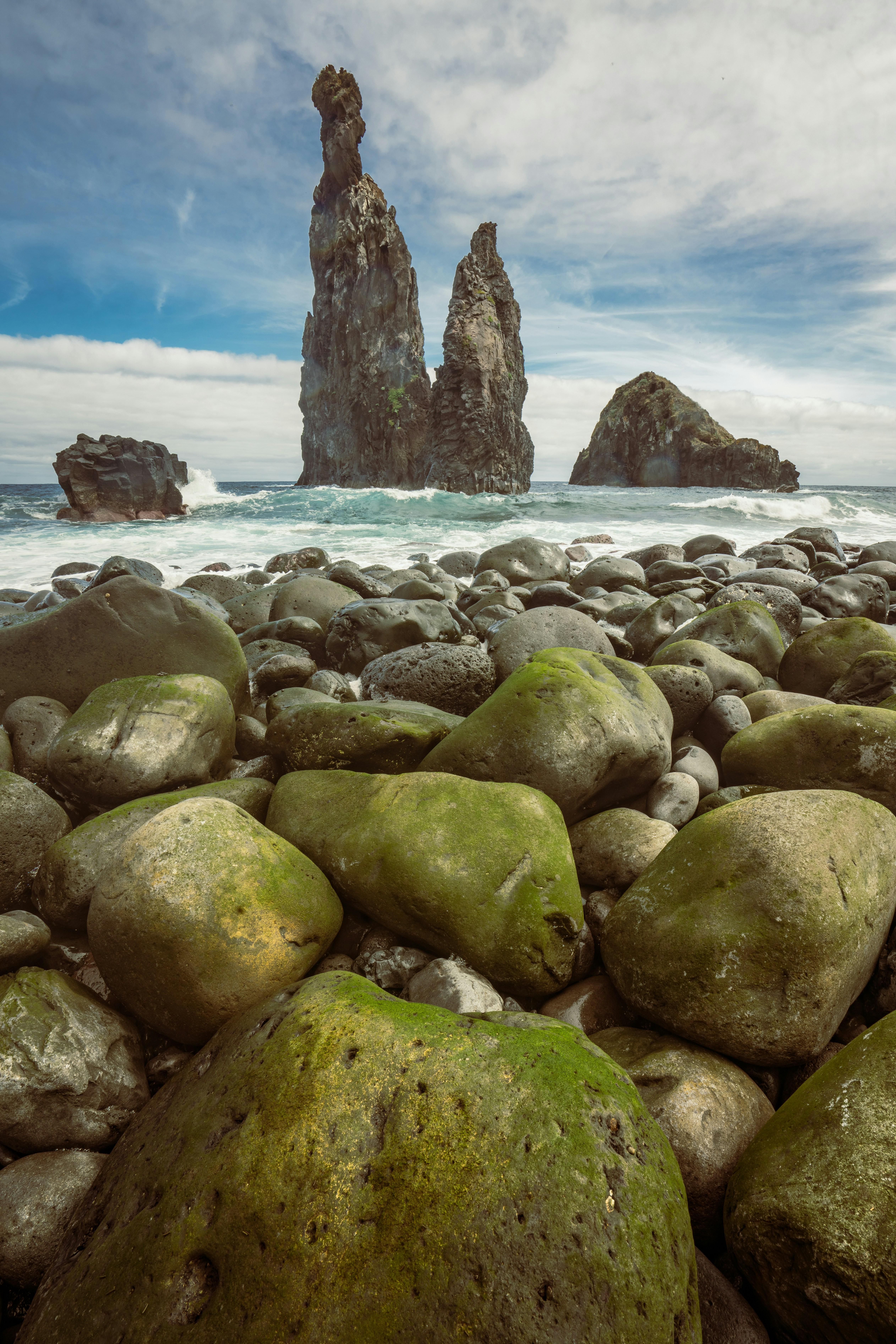 Stone Sentinels on a Mossy Shore