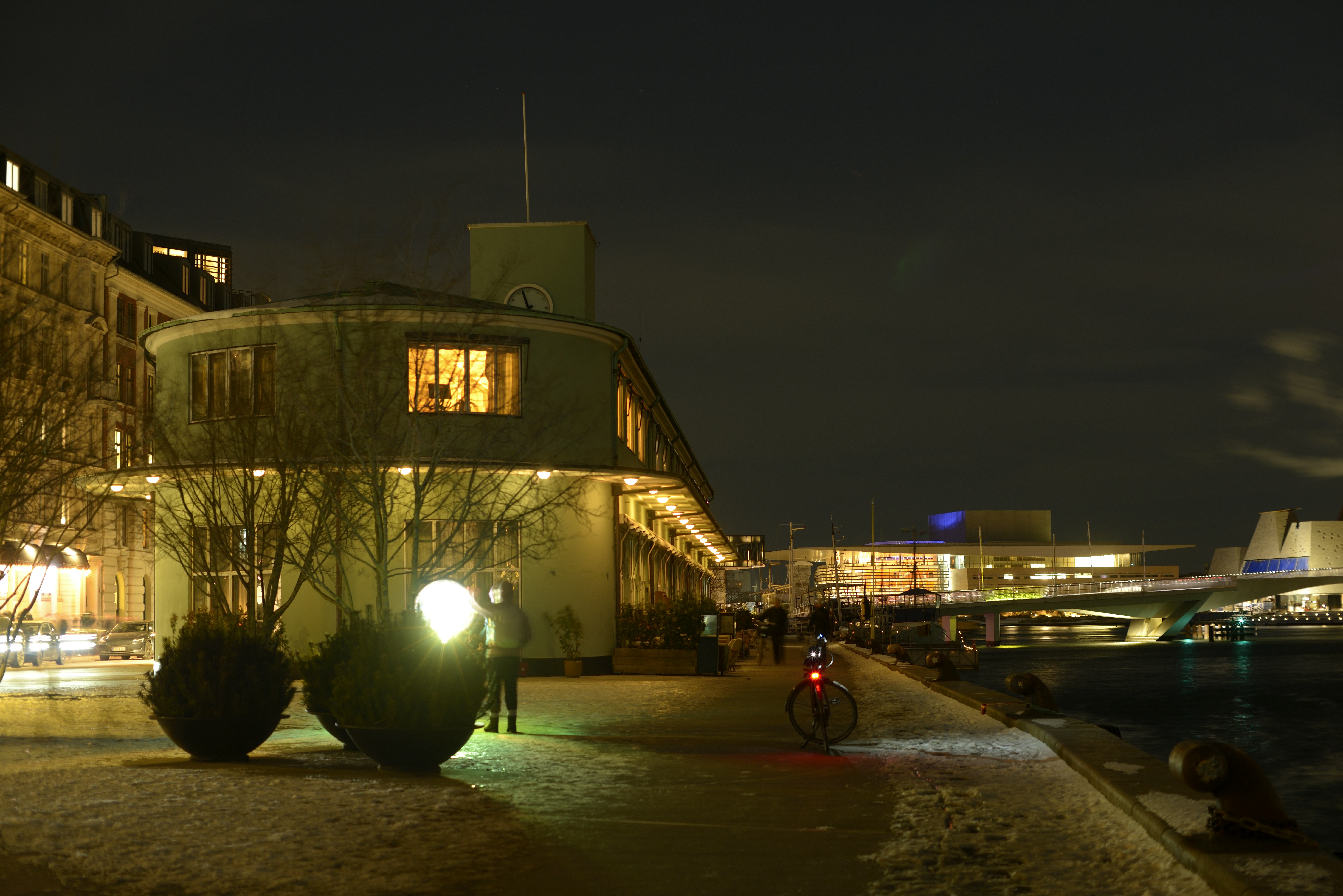 Lakeside Nightfall: Warm Window Light by the Pier