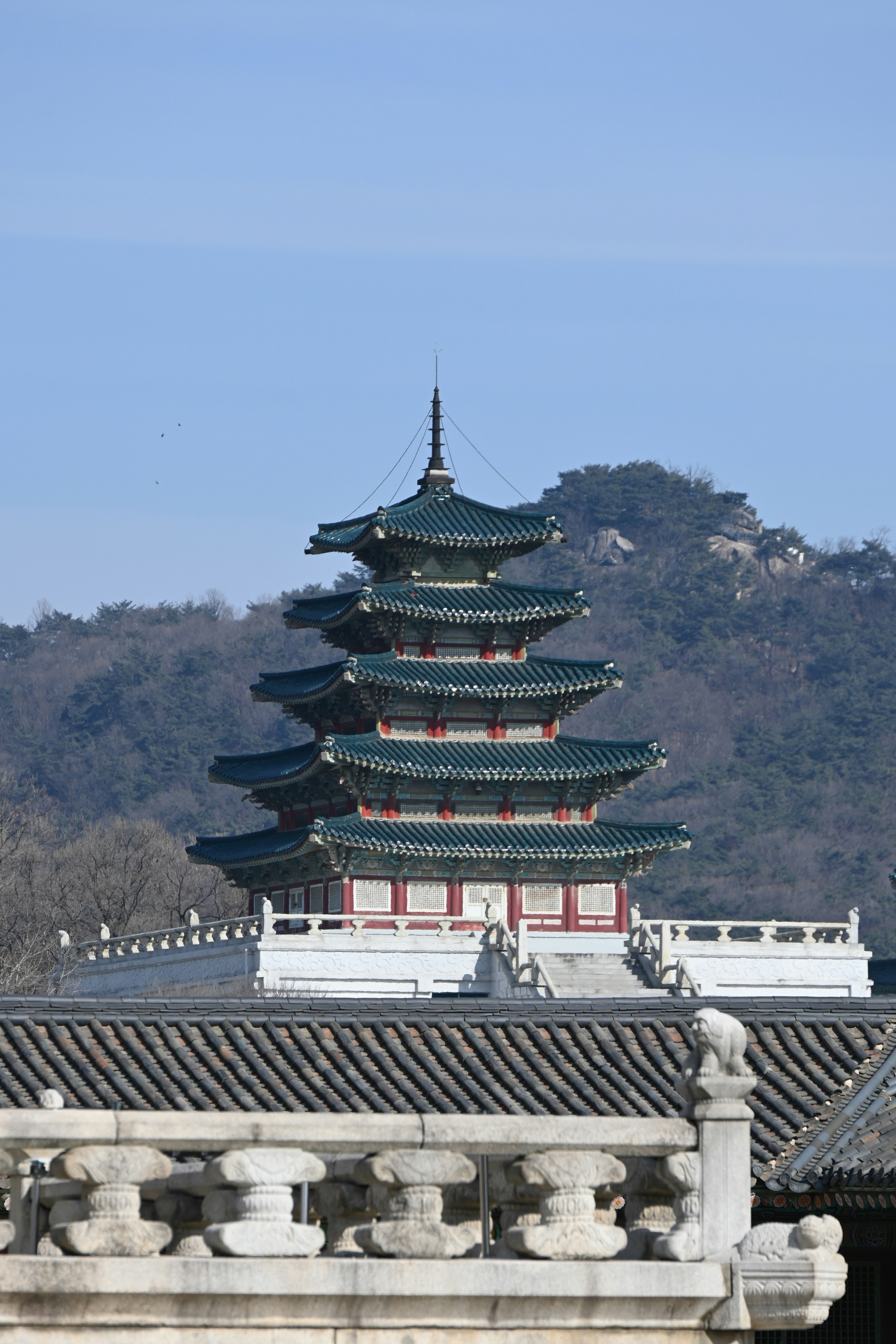 Five-Tiered Roofscape: A Korean Pagoda Rising Above the Courtyard