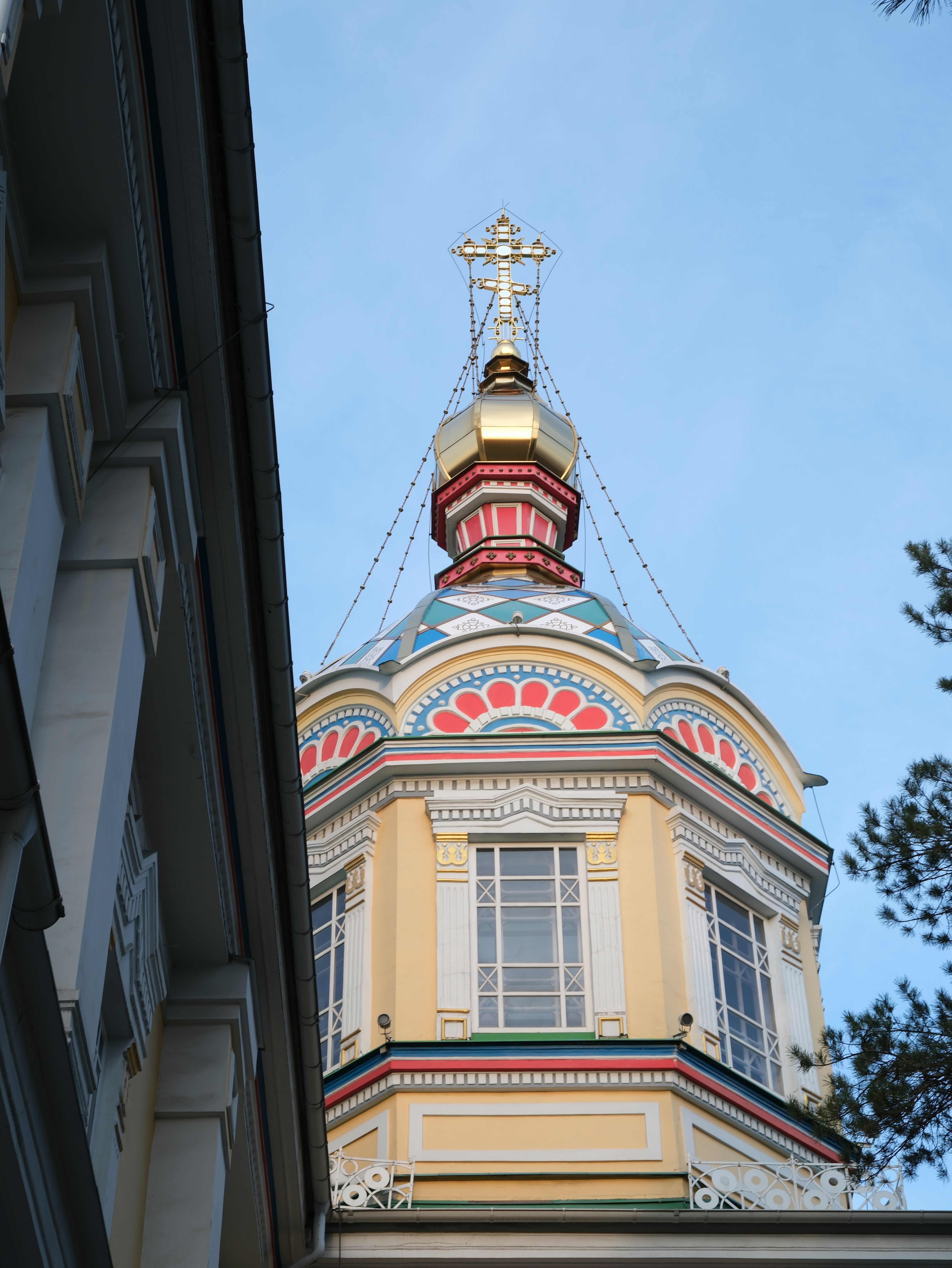 Colorful Tiered Cathedral Spire Reaching Toward a Clear Sky