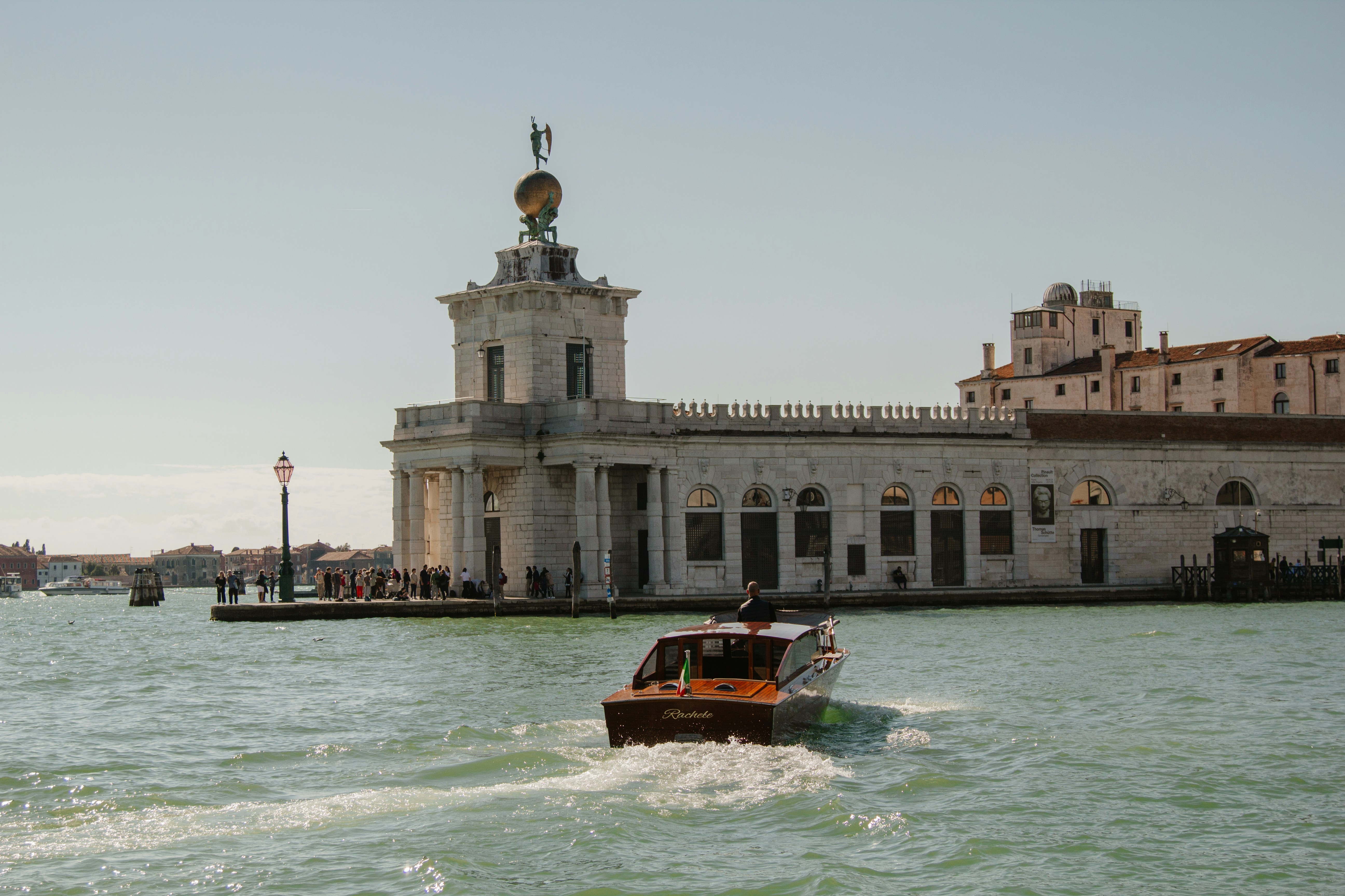 Gondola Wake at the Rialto: A Boat Curves Past the Grand Arsenal