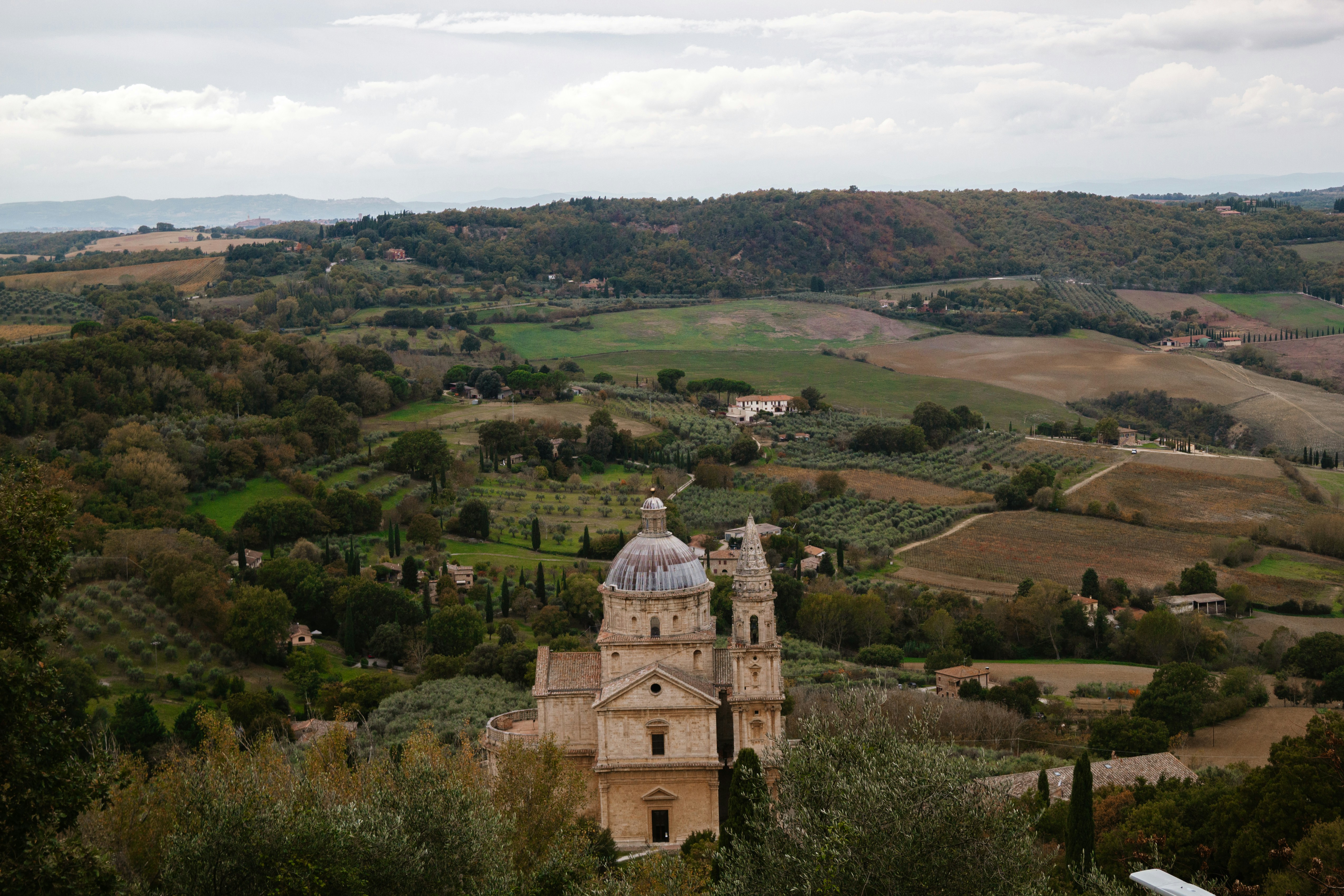 Hilltop Church Amid Rolling Tuscan Valleys at Dusk