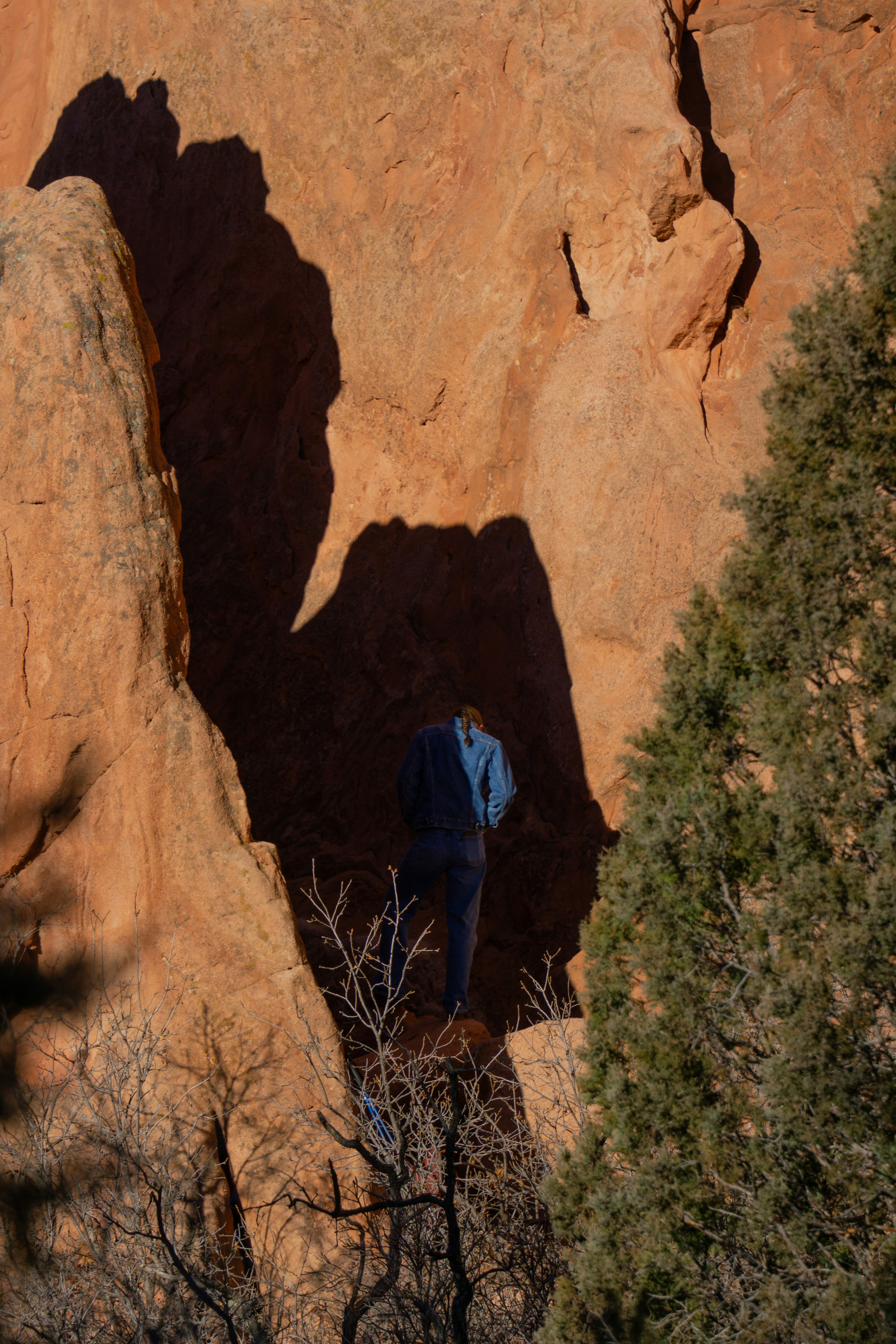 Hidden Figure Between Red Canyon Walls