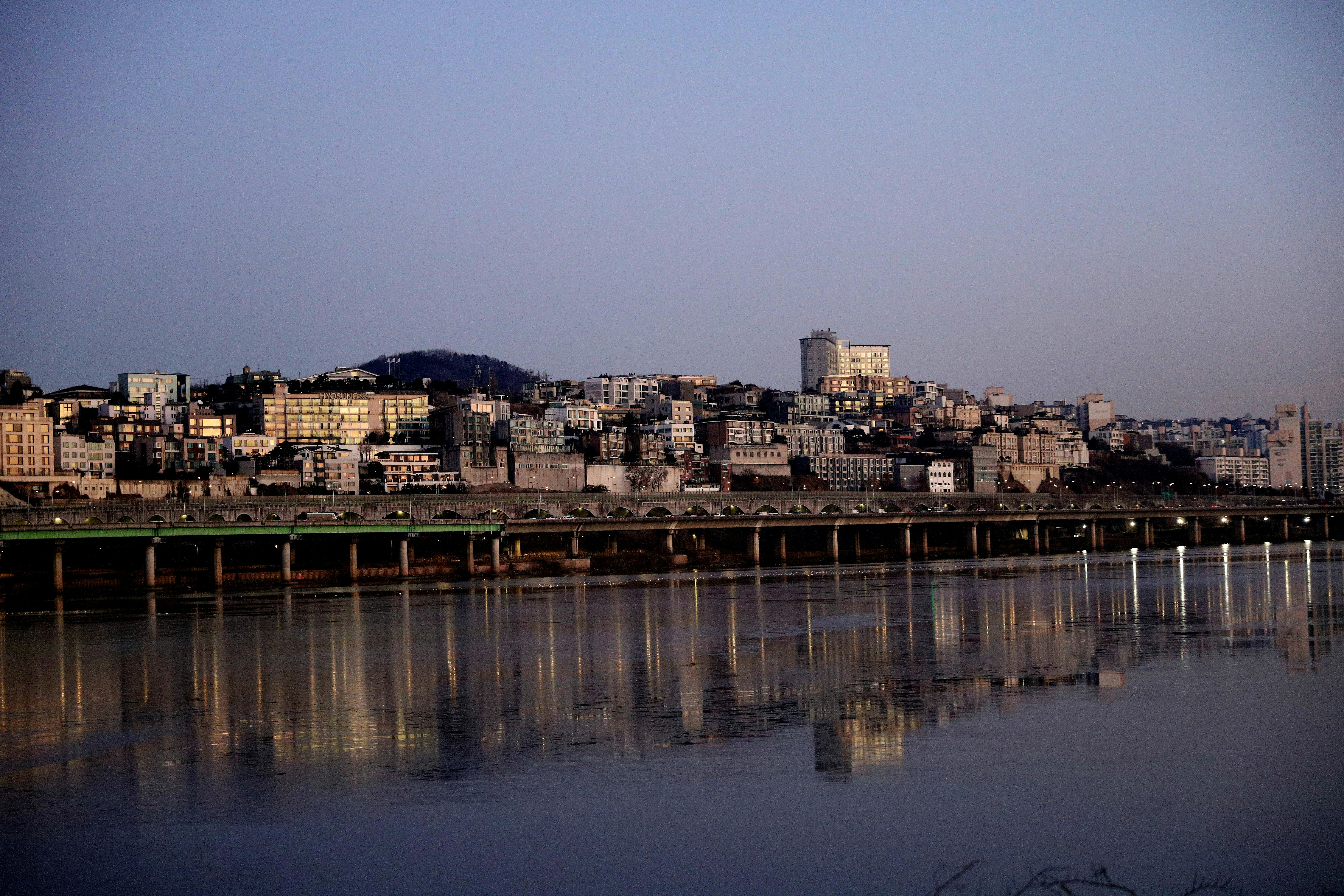 Quiet Riverside Skyline at Dusk