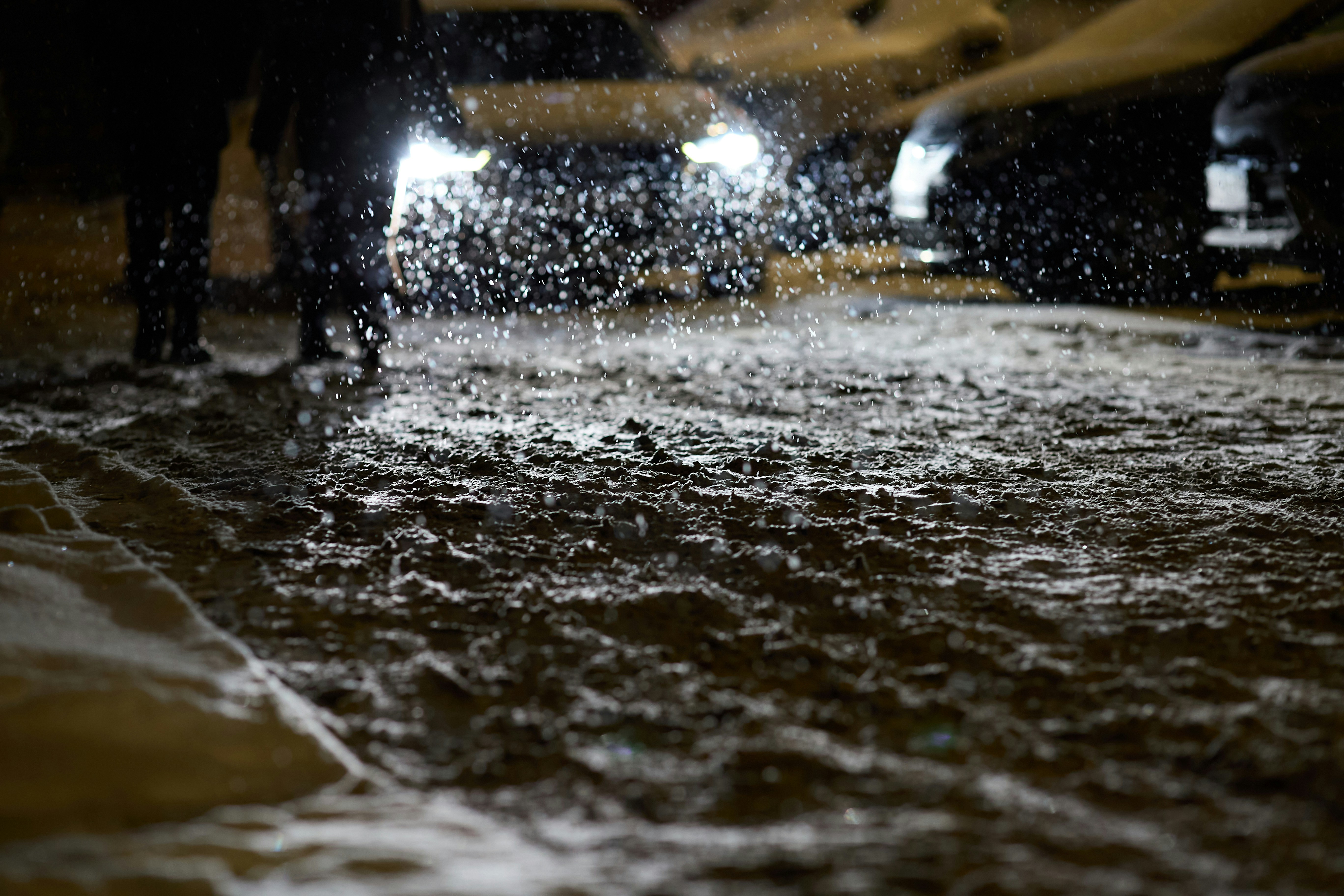Midnight Splash: Reflections on a Snow-Dusted Street