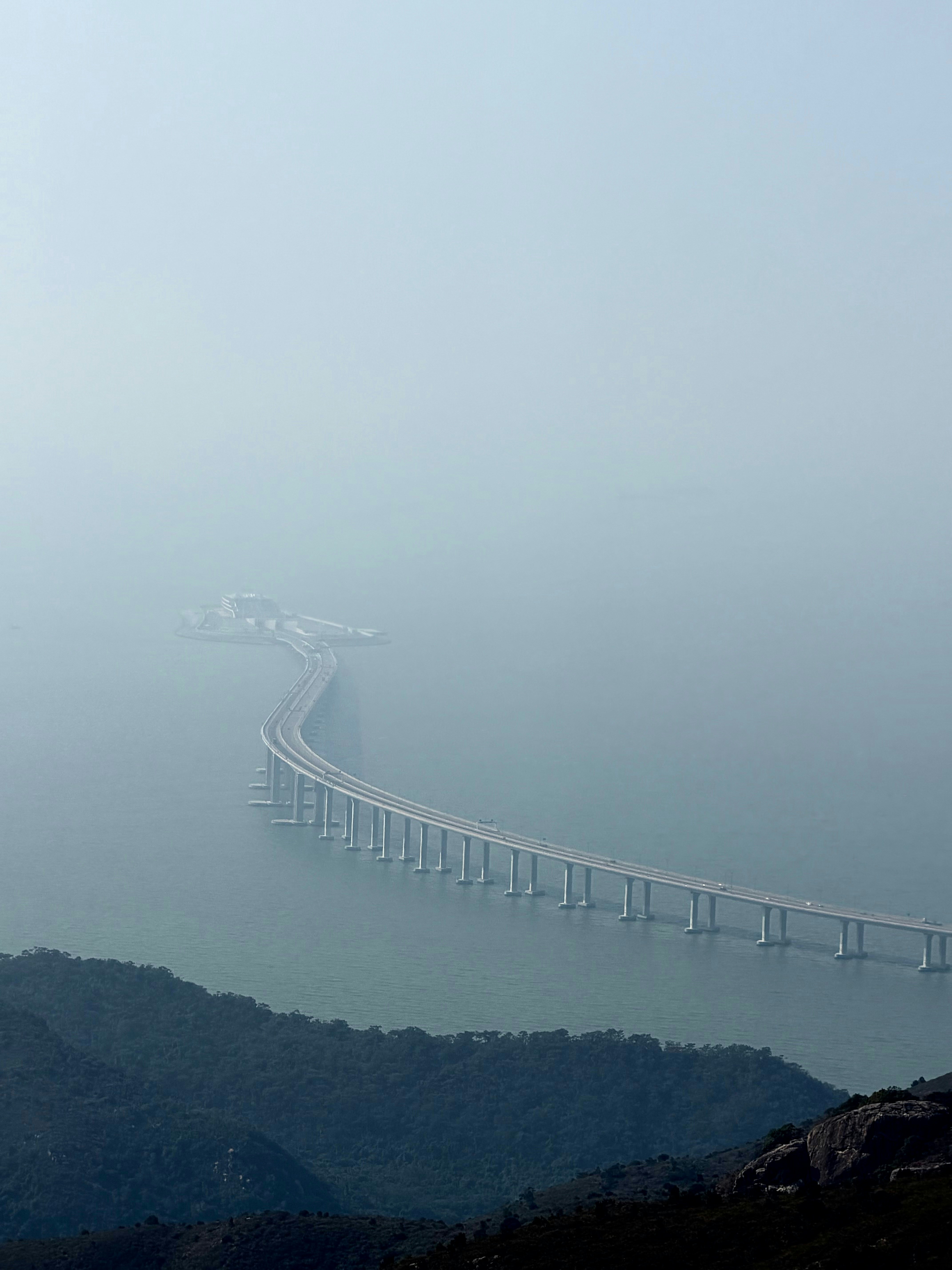 Mist-Softened Bridle: A Coastal Bridge Winding into the Fog