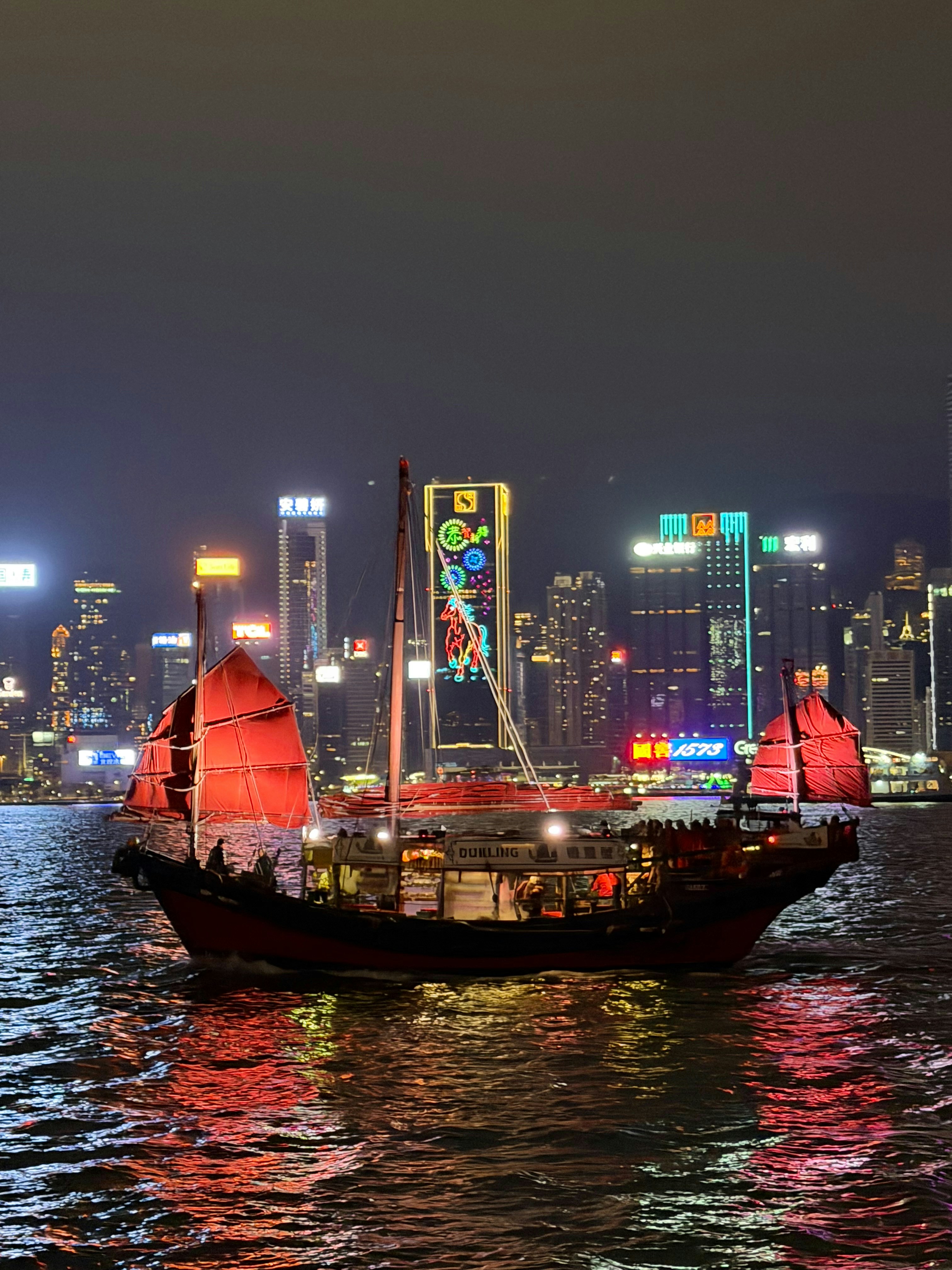 Red-sailed Junk Drifting Across Neon Shanghai Night