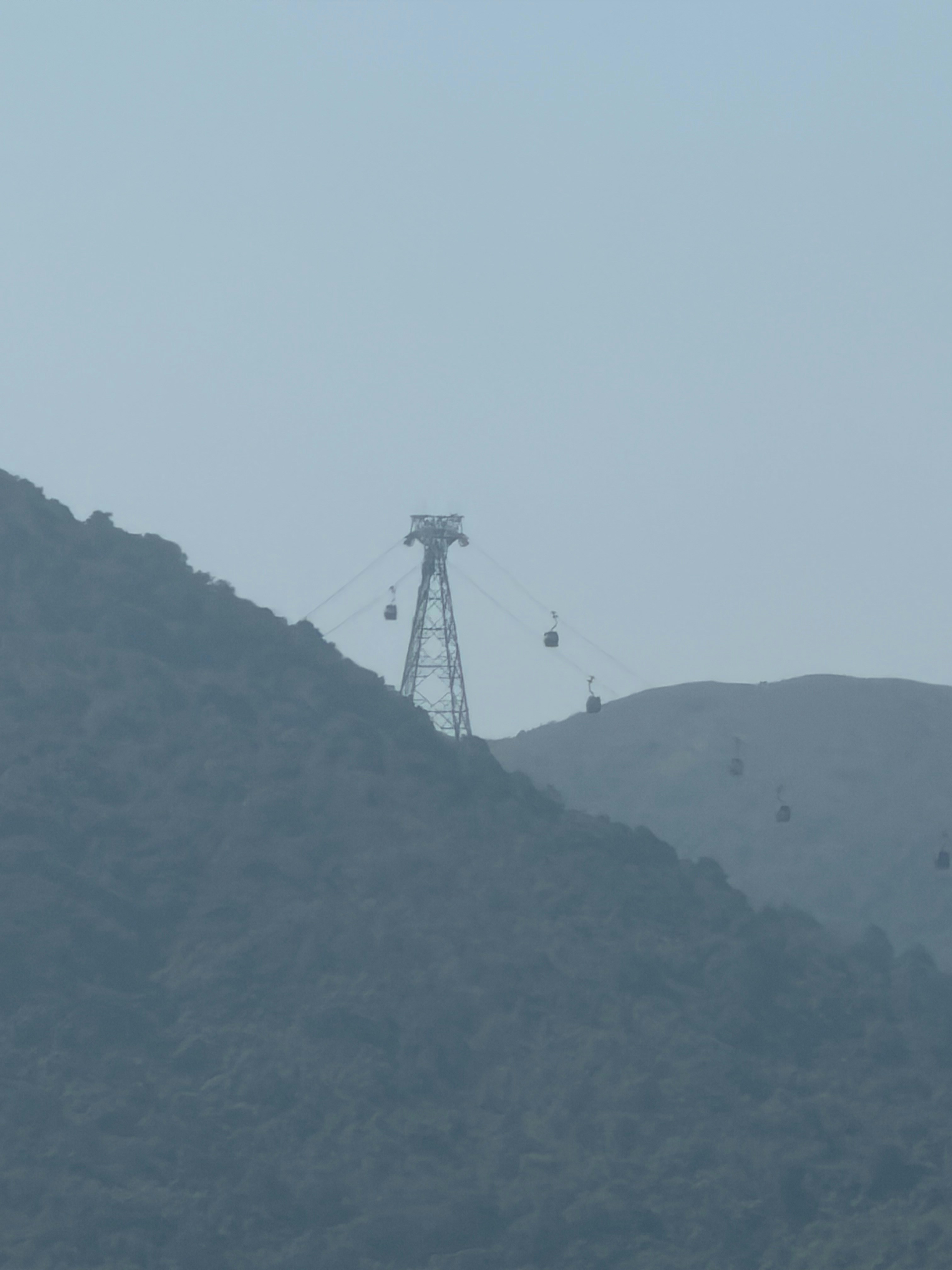 Cable Car Sentinel Among Misty Hills