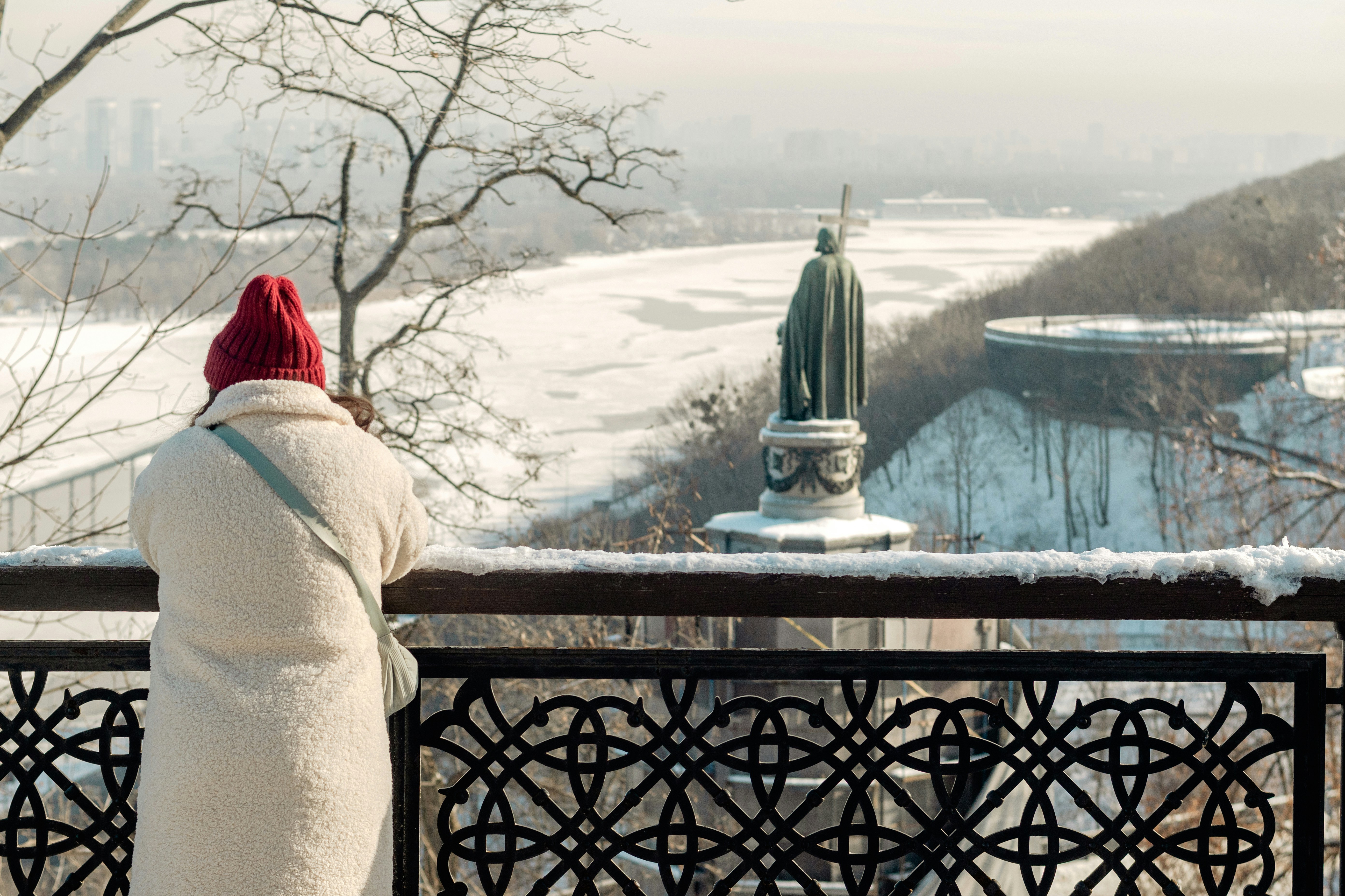 Winter Overlook: A Quiet Person and a Distant Statue