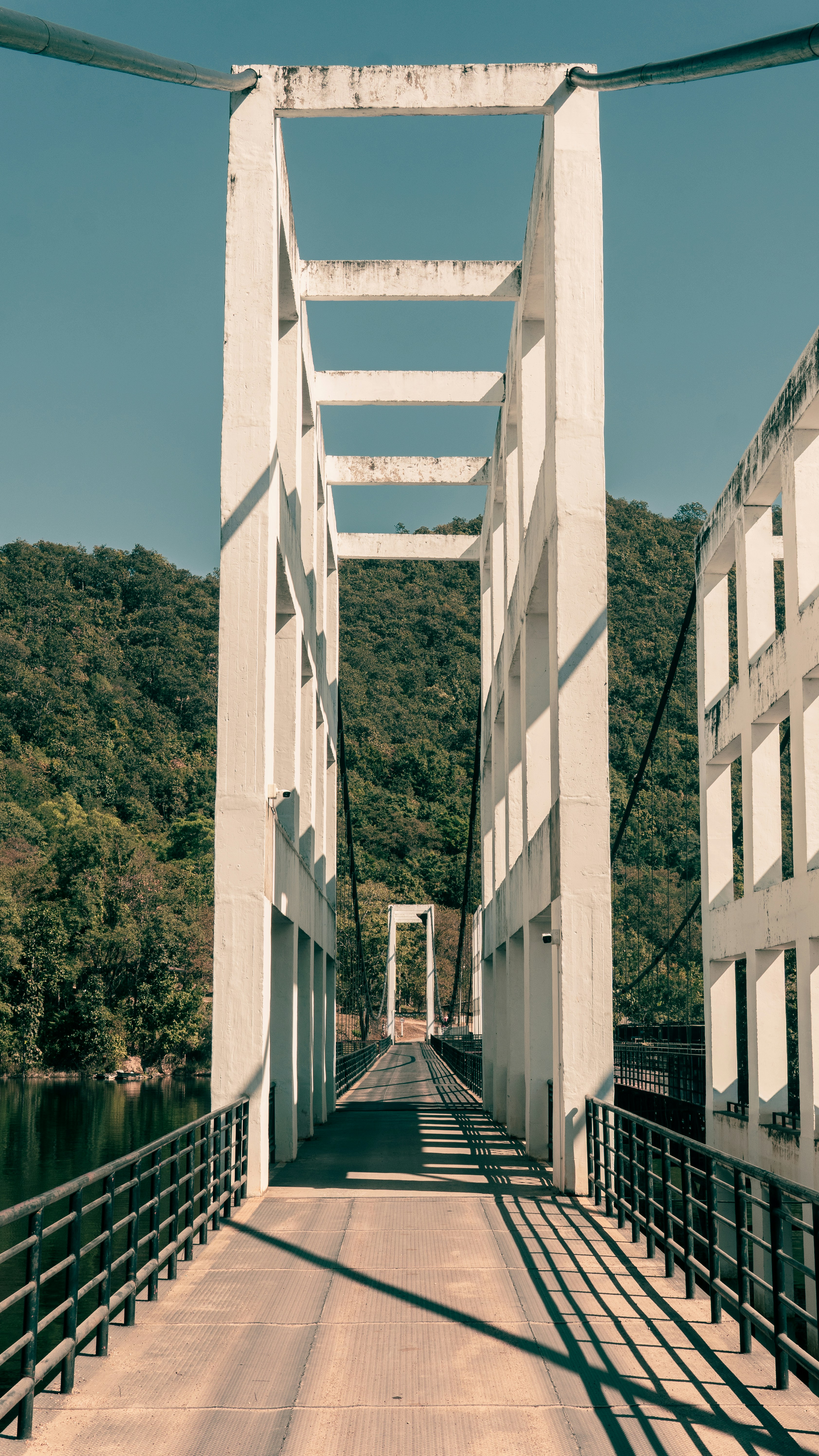 Symmetrical Bridge Corridor Reaching Toward a Distant Vanishing Point