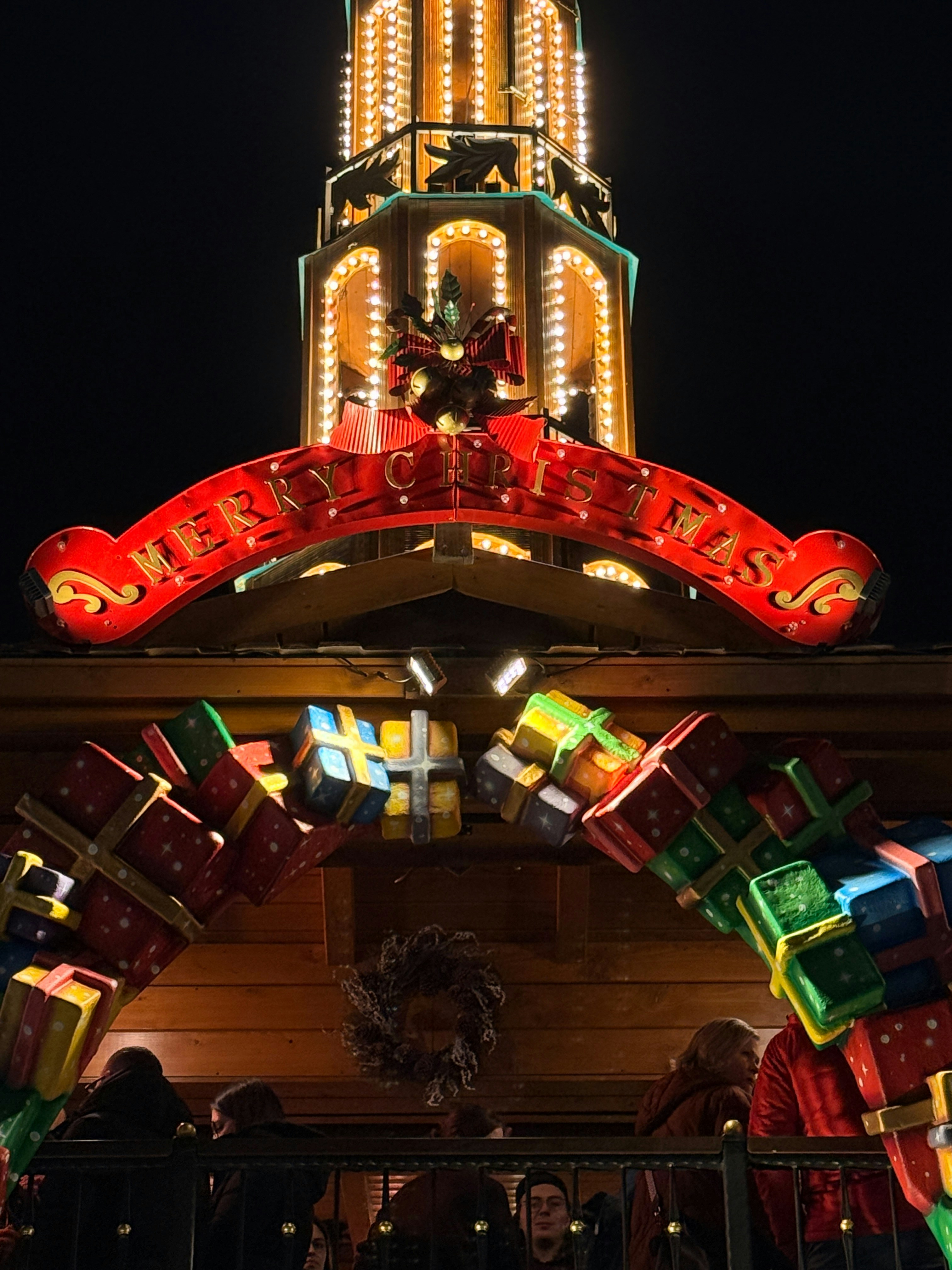 Candy-Cane Archway Beneath a Christmas Clock Tower