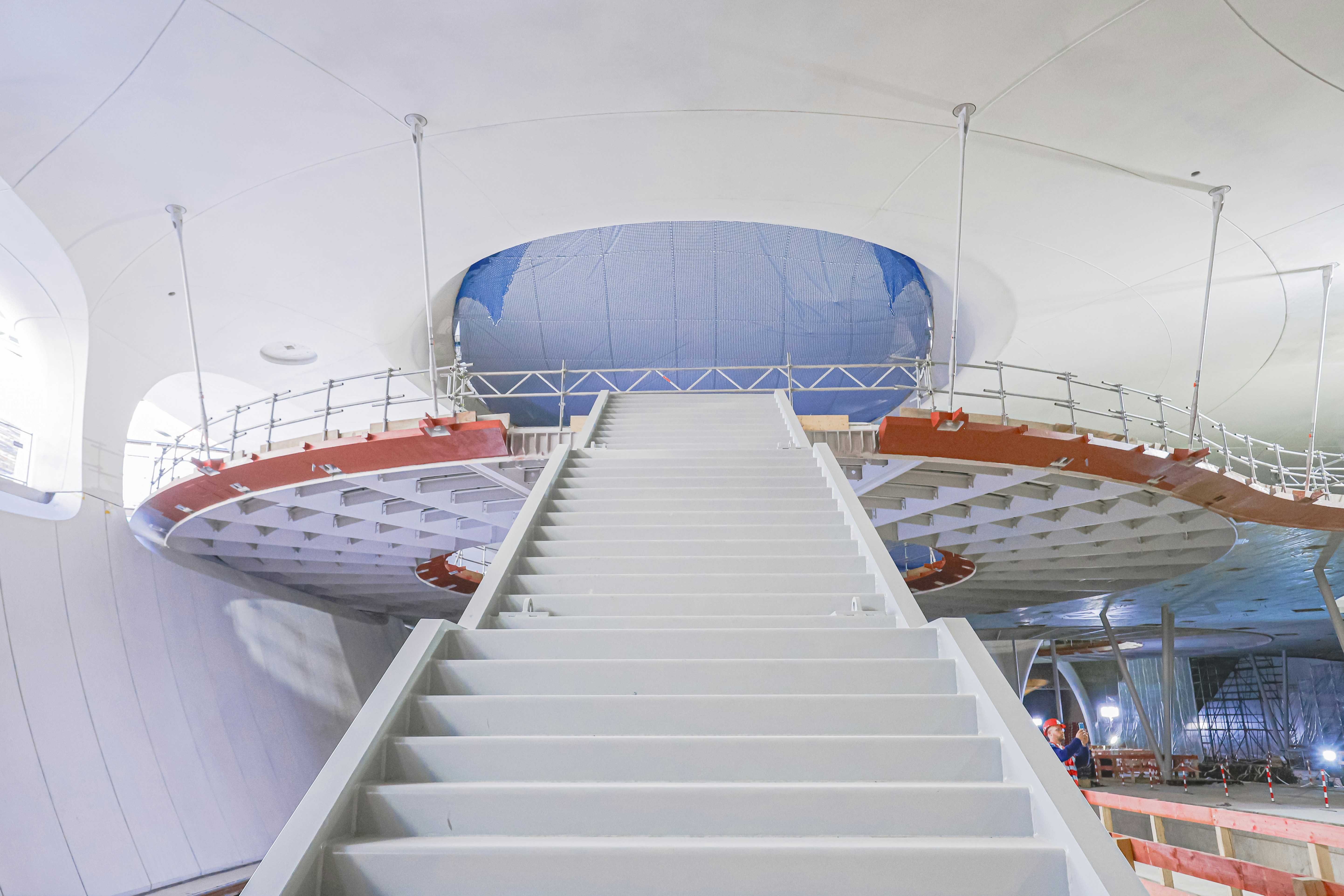 Ascending to the Orb: Centerstage on a Space-age Staircase