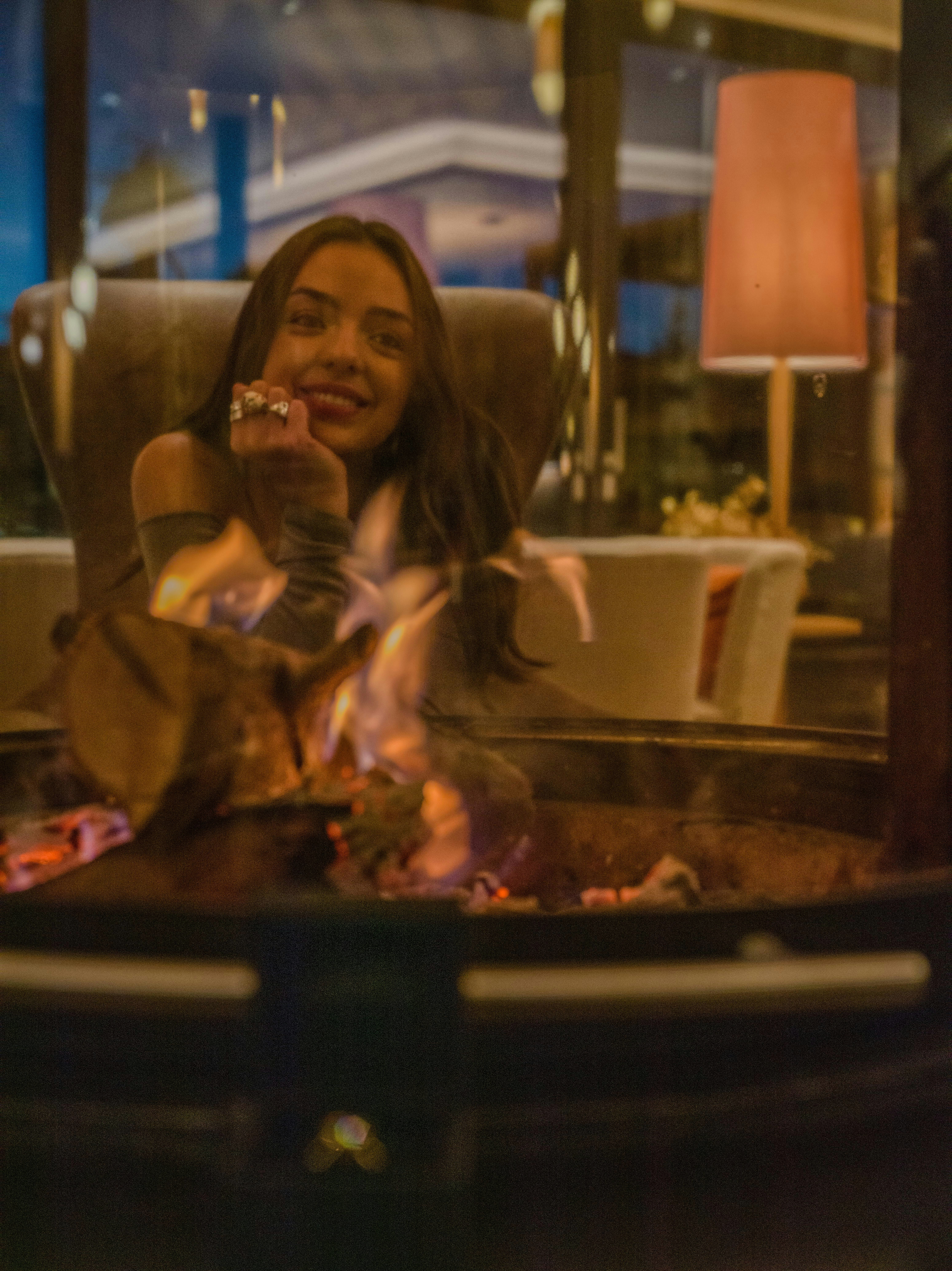 Warm Gaze by the Fireside: A Quiet Moment in Amber Light