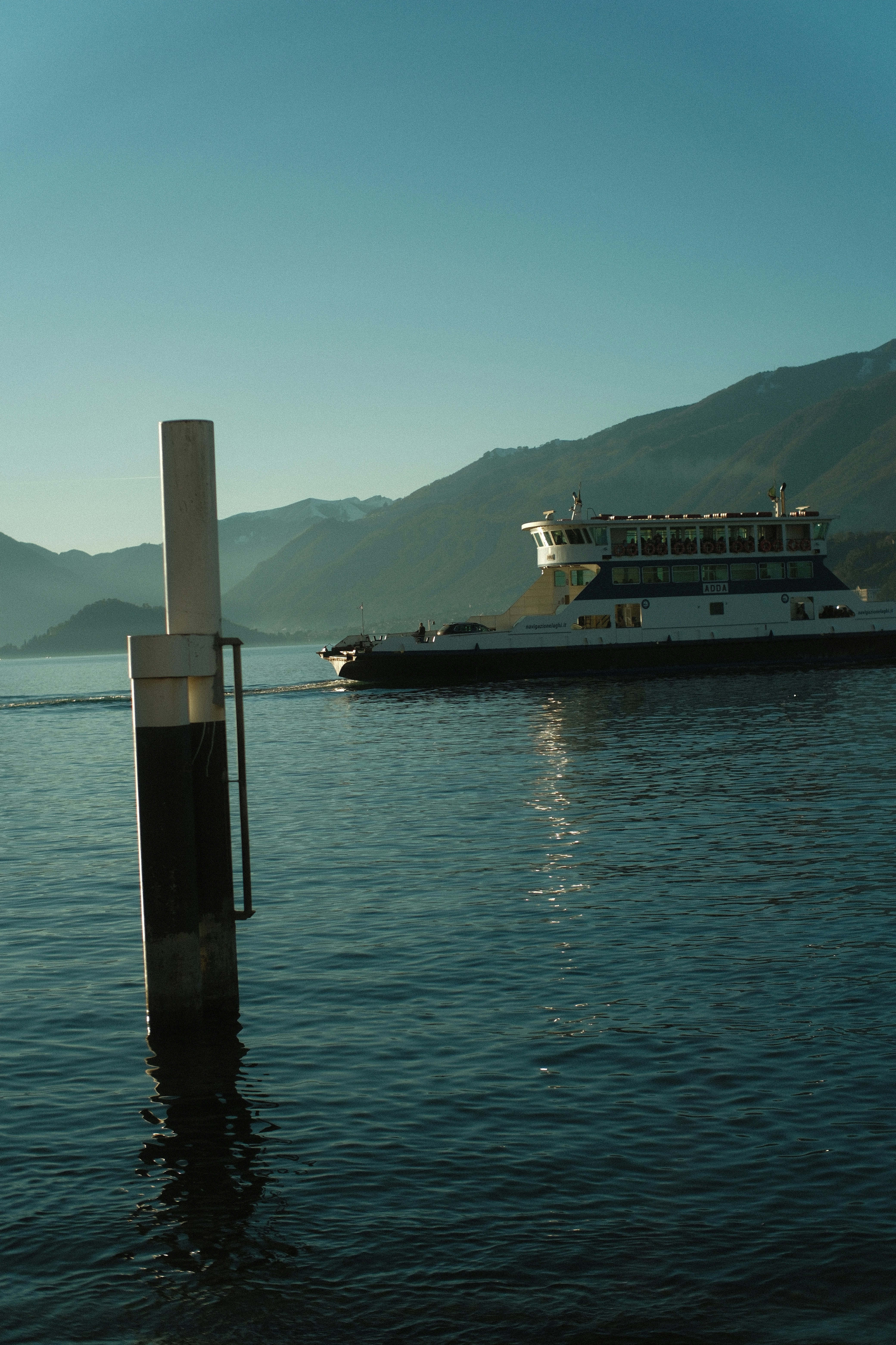 Harbor Crossing: A Quiet Ferry Under Mountain Veil