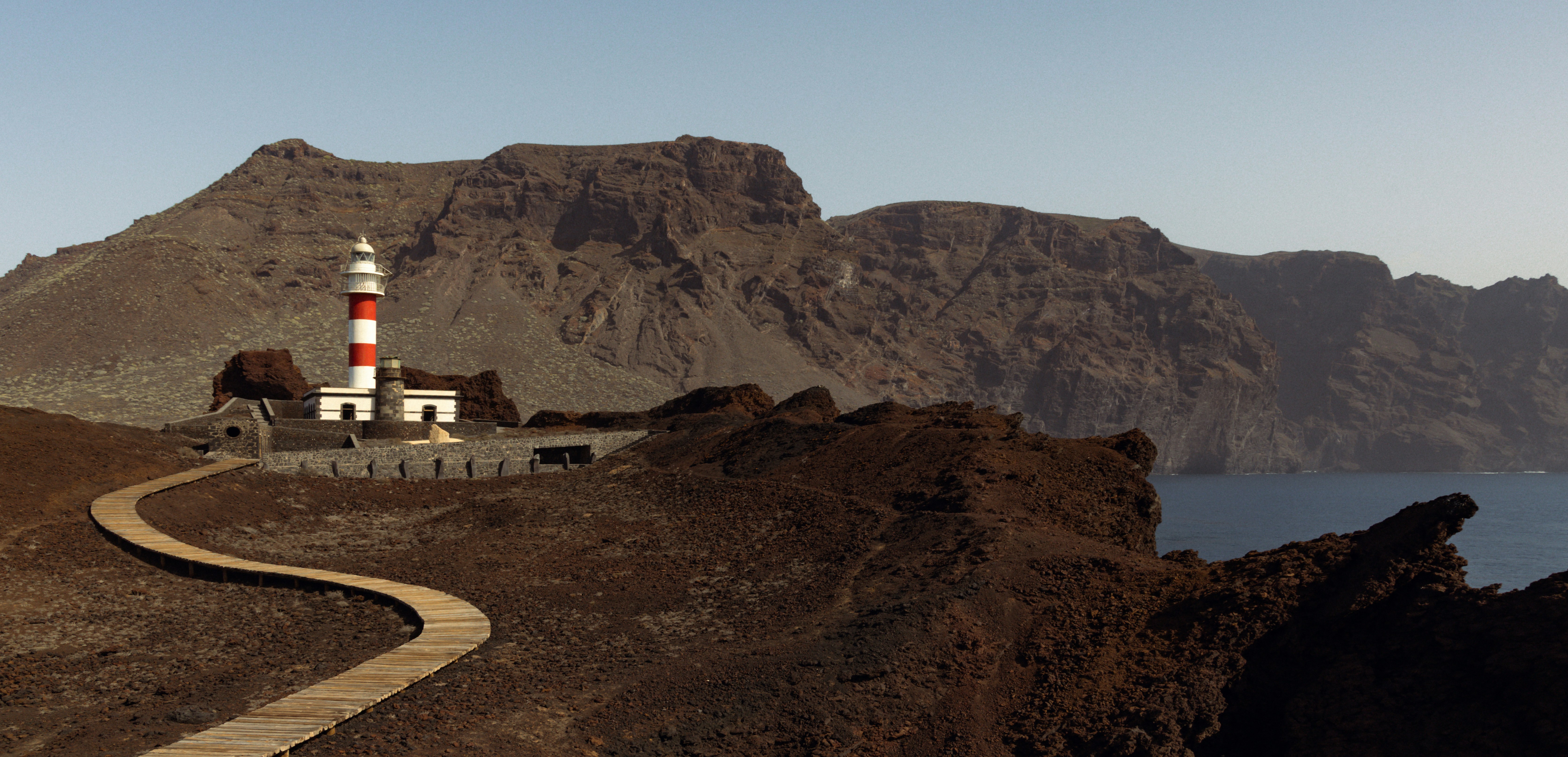 Lighthouse on the Edge: A Winding Path to the Cliffside Beacon