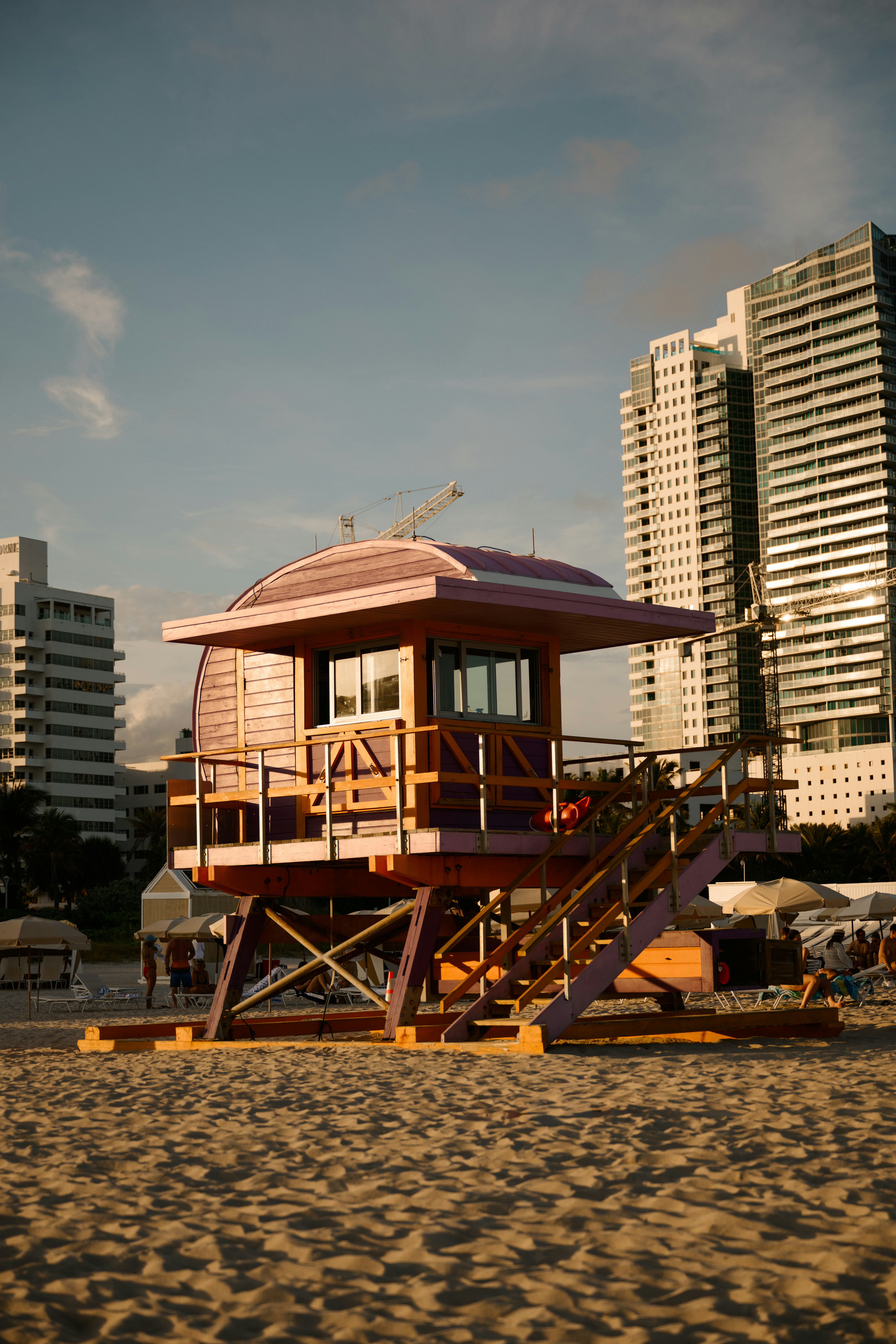 Lifeguard Pavilion: Sunset Shadow on the Beachfront High-Rise Horizon