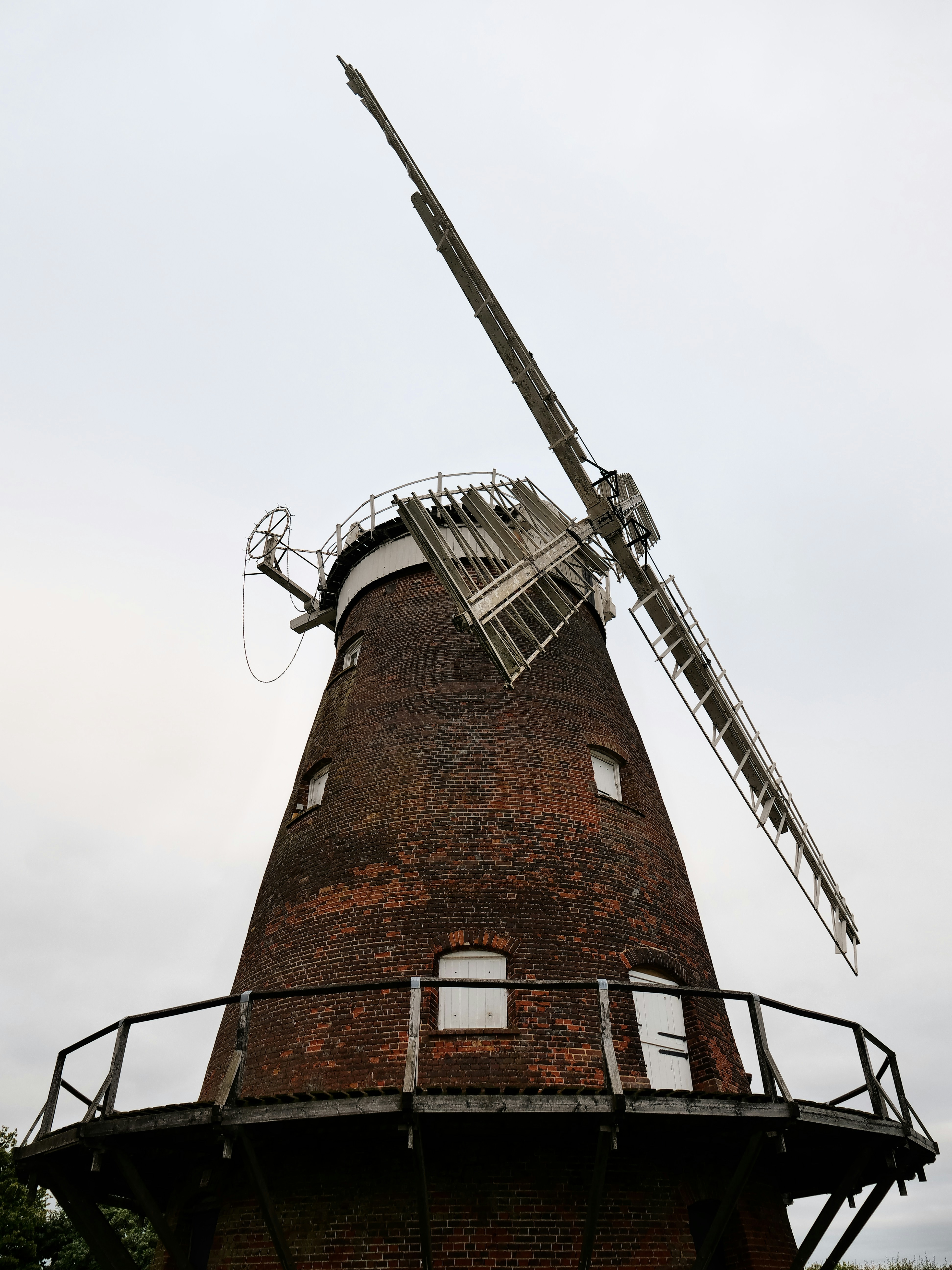 Brick Beacon: An Old Windmill Reaching Toward a Grey Sky