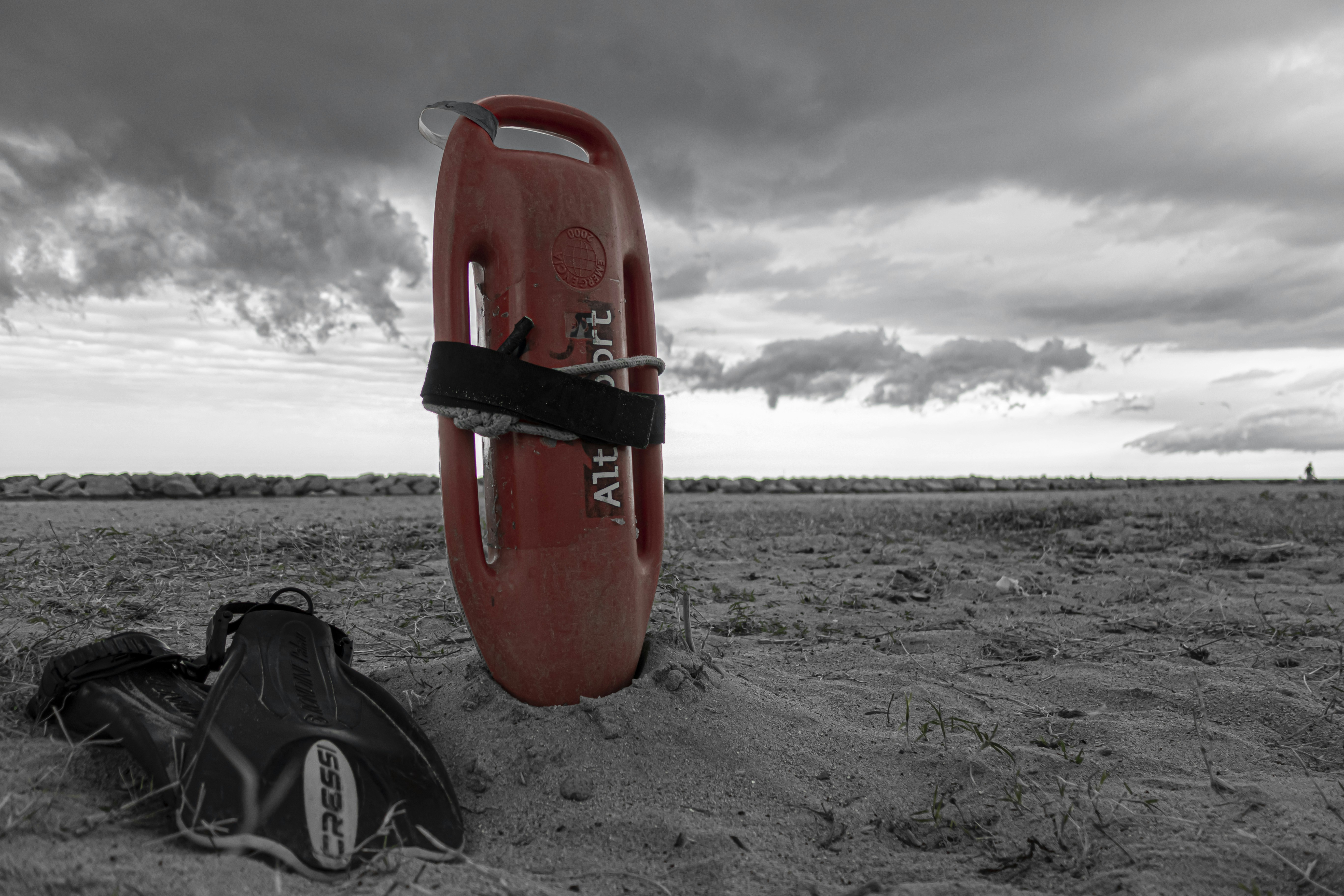 Lifebuoy on a desolate shoreline at dusk